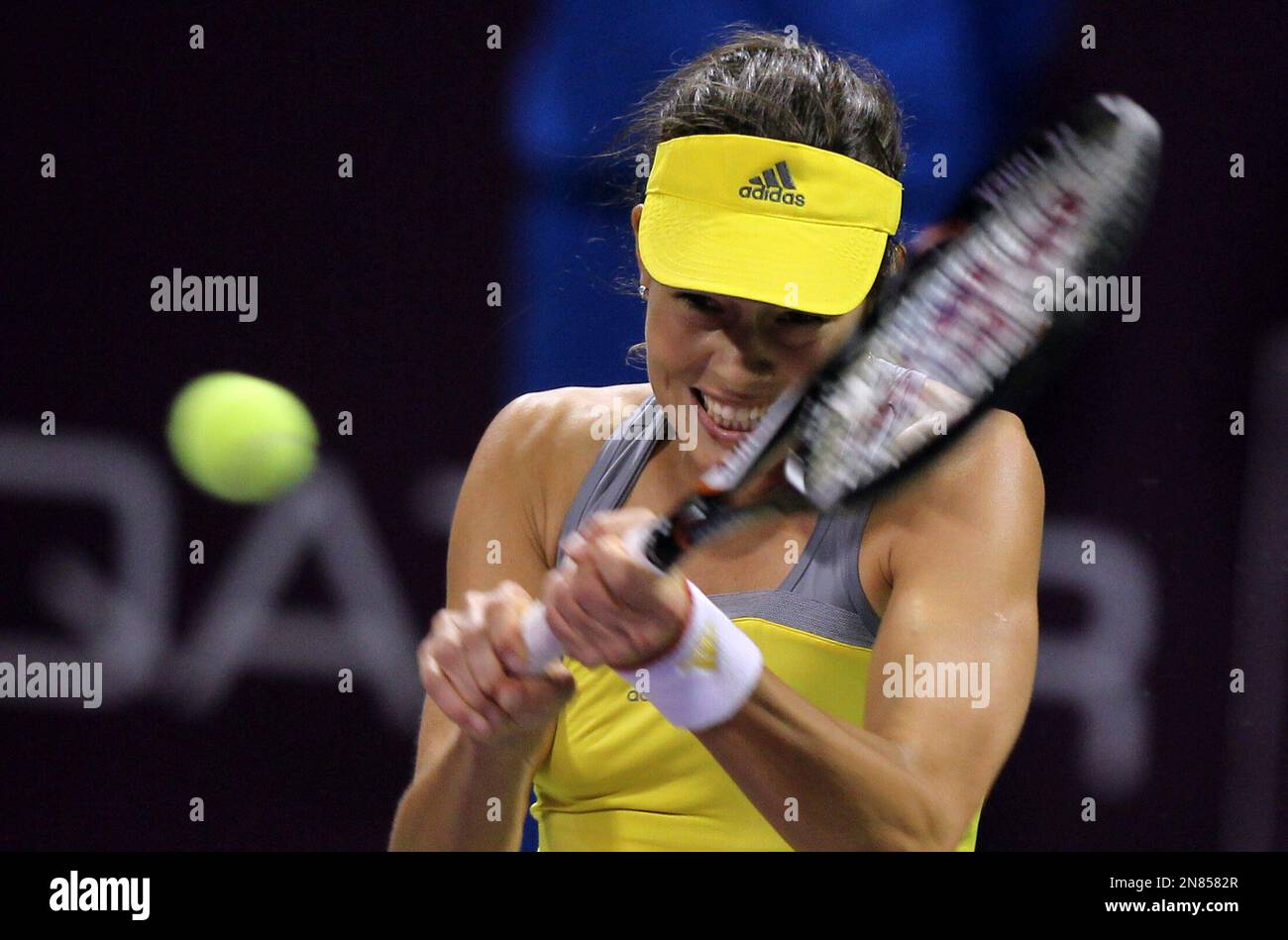 Ana Ivanovic of Serbia returns the ball during her match against Tamira ...