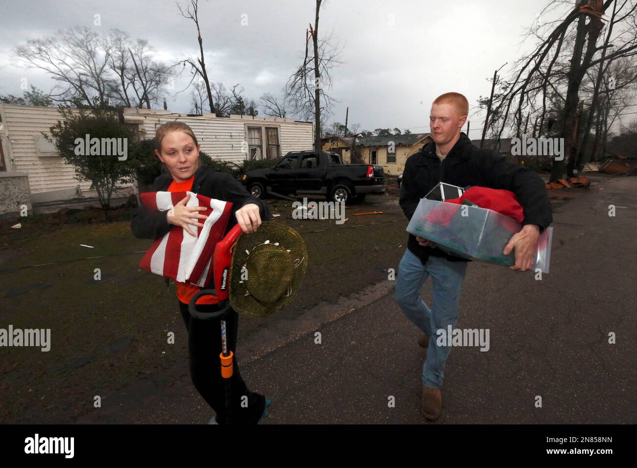 Amy McQueen, 28, helps her brother, who wished to be unidentified, move ...