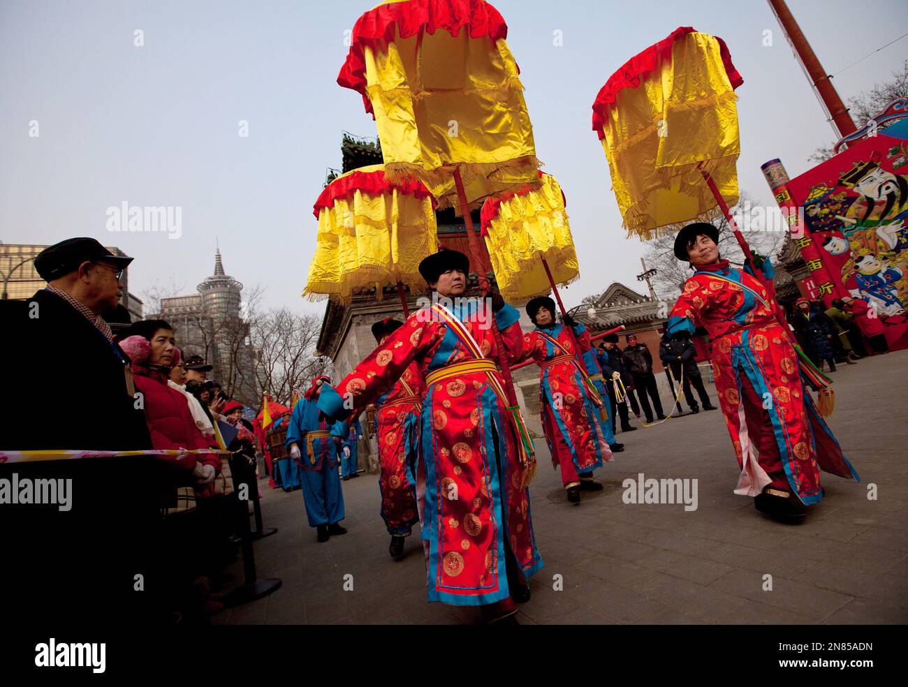 Chinese dressed in traditional costumes participate in a performance at ...