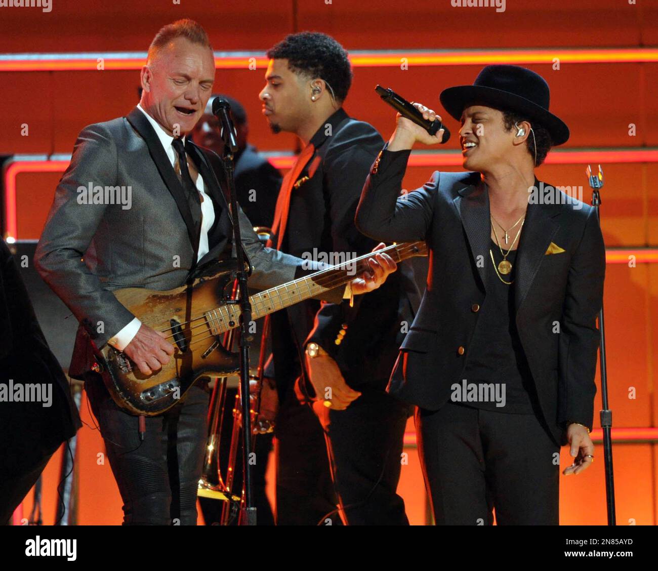 Recording artists Sting, left, and Bruno Mars perform a tribute to Bob ...