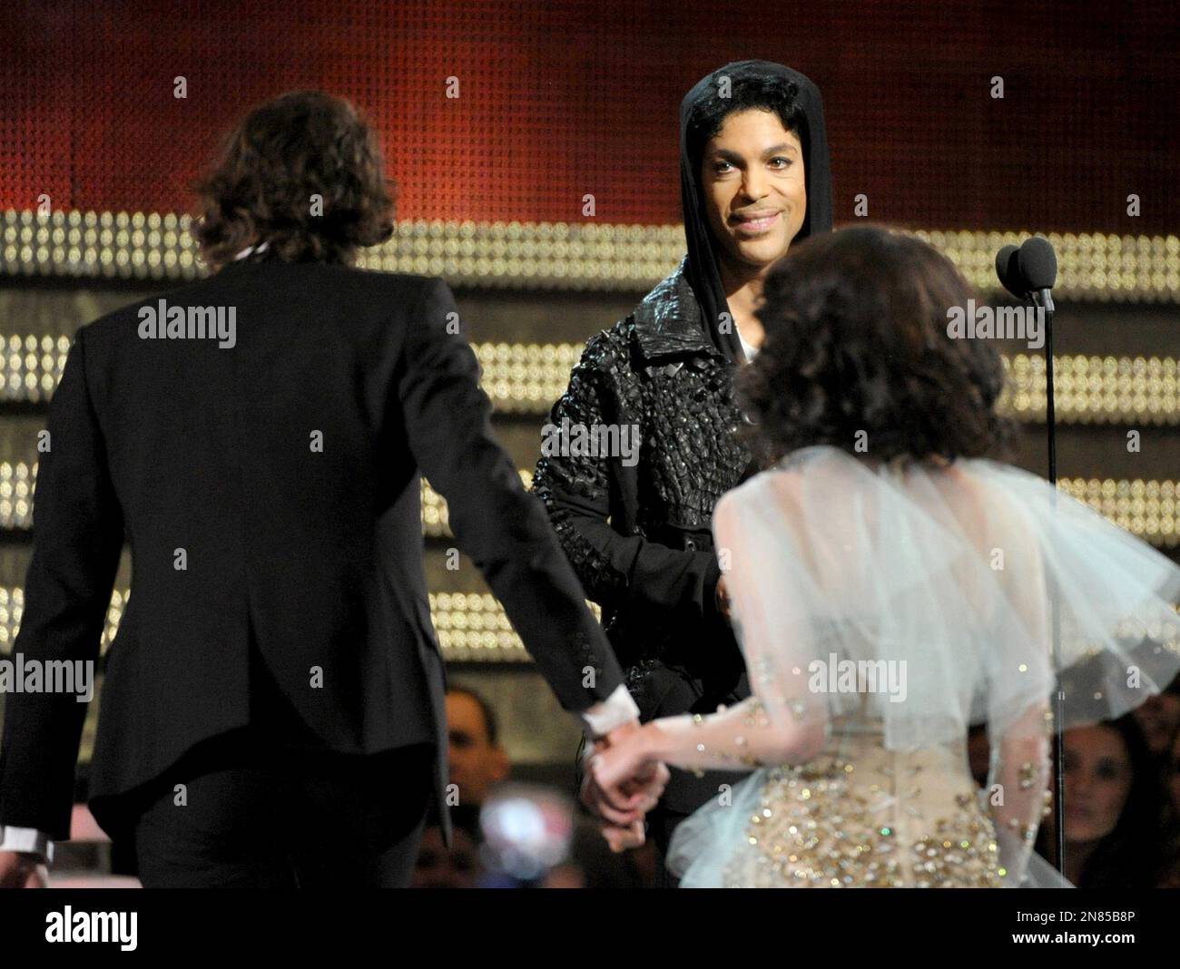 Prince, presents the award for record of the year for "Somebody That I ...