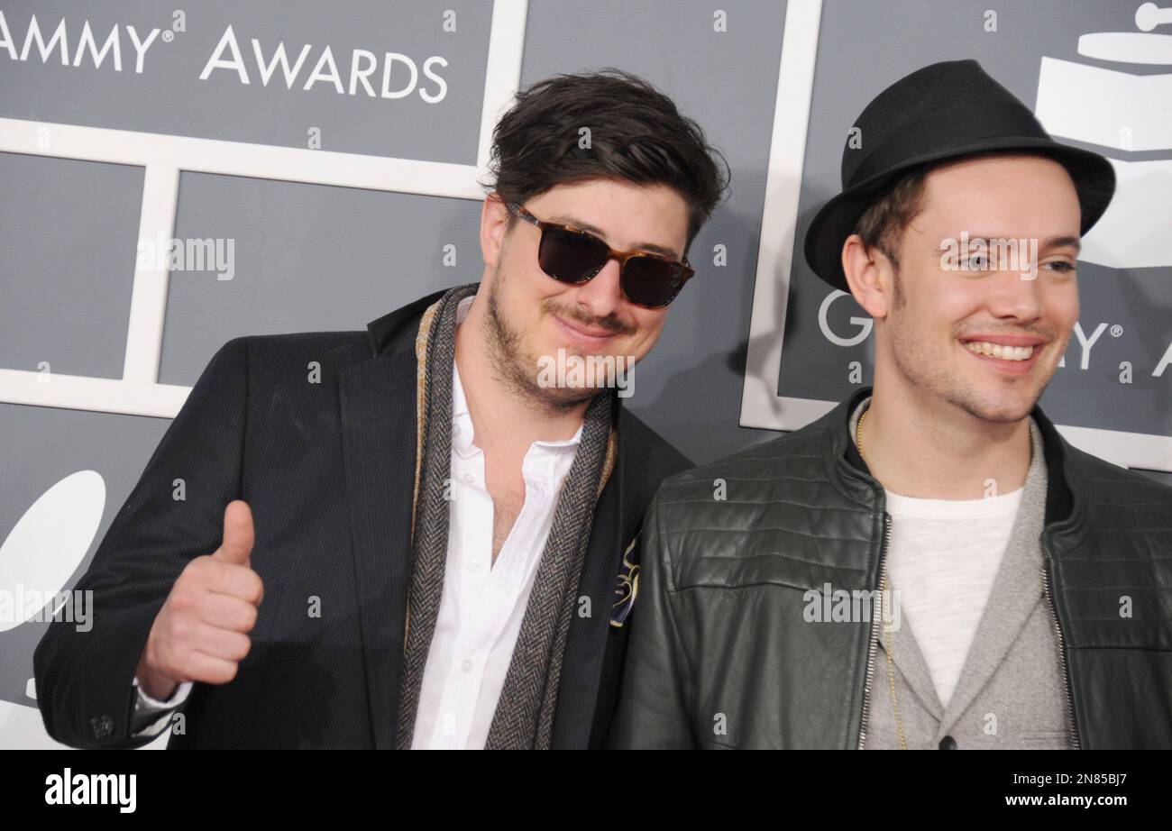 From left, Marcus Mumford, and Ben Lovett of Mumford & Sons arrive at ...
