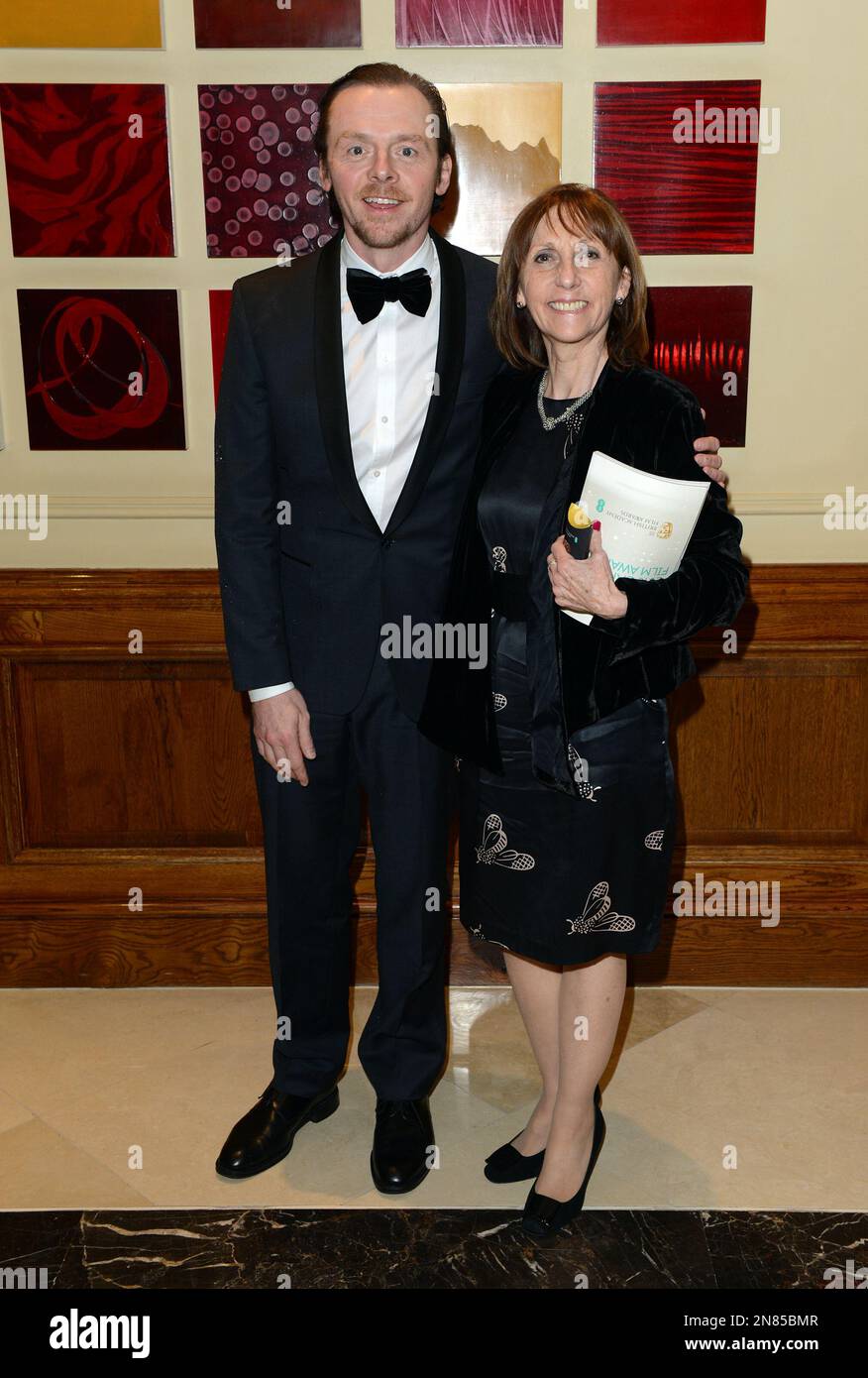 Simon Pegg, left, and his mother Gillian Rosemary Smith seen arriving ...