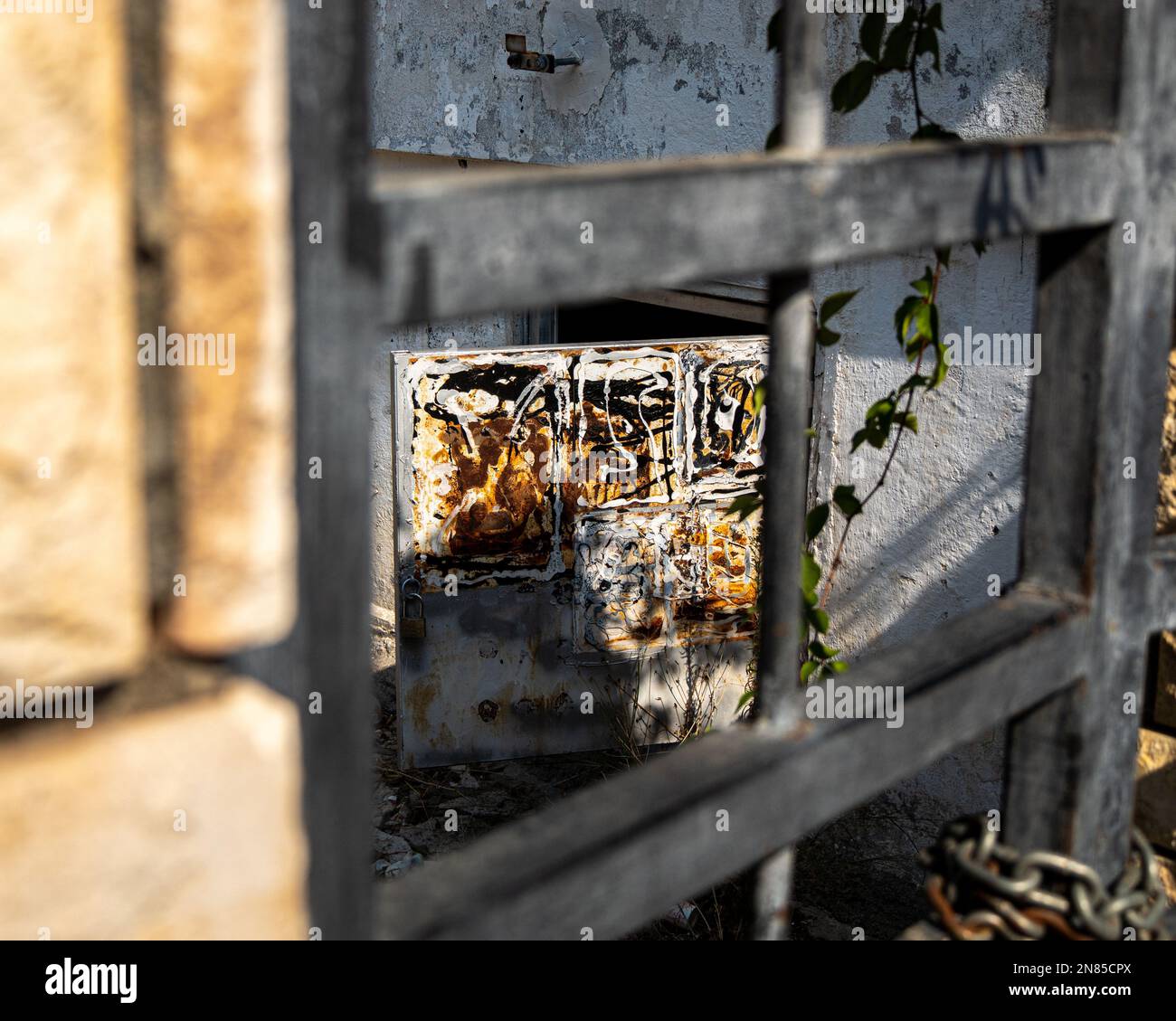 The view through old gates into the fuse electrical box door Stock ...