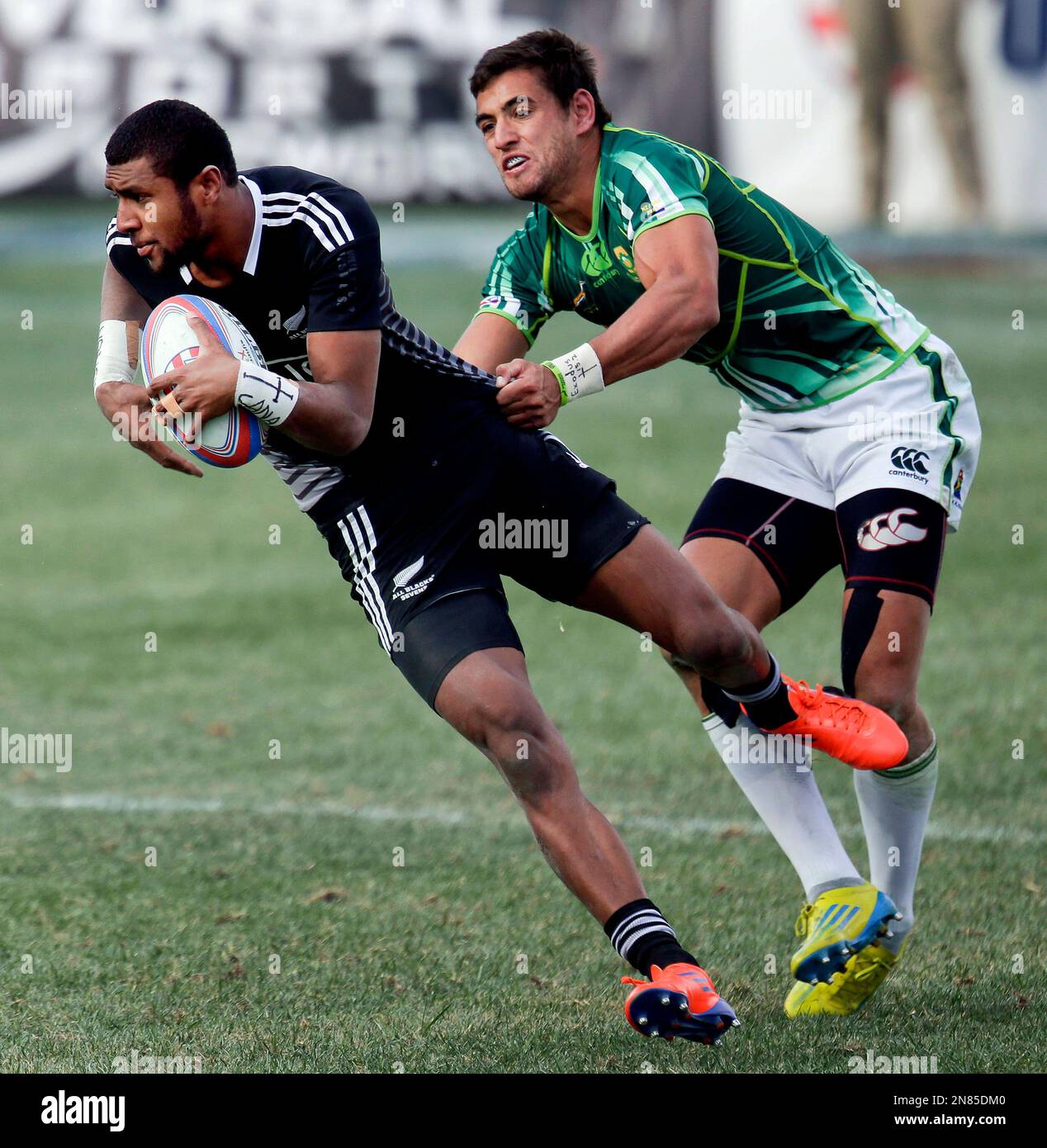 South Africa's Chris Dry, right, grabs New Zealand's Luke Masirewa ...