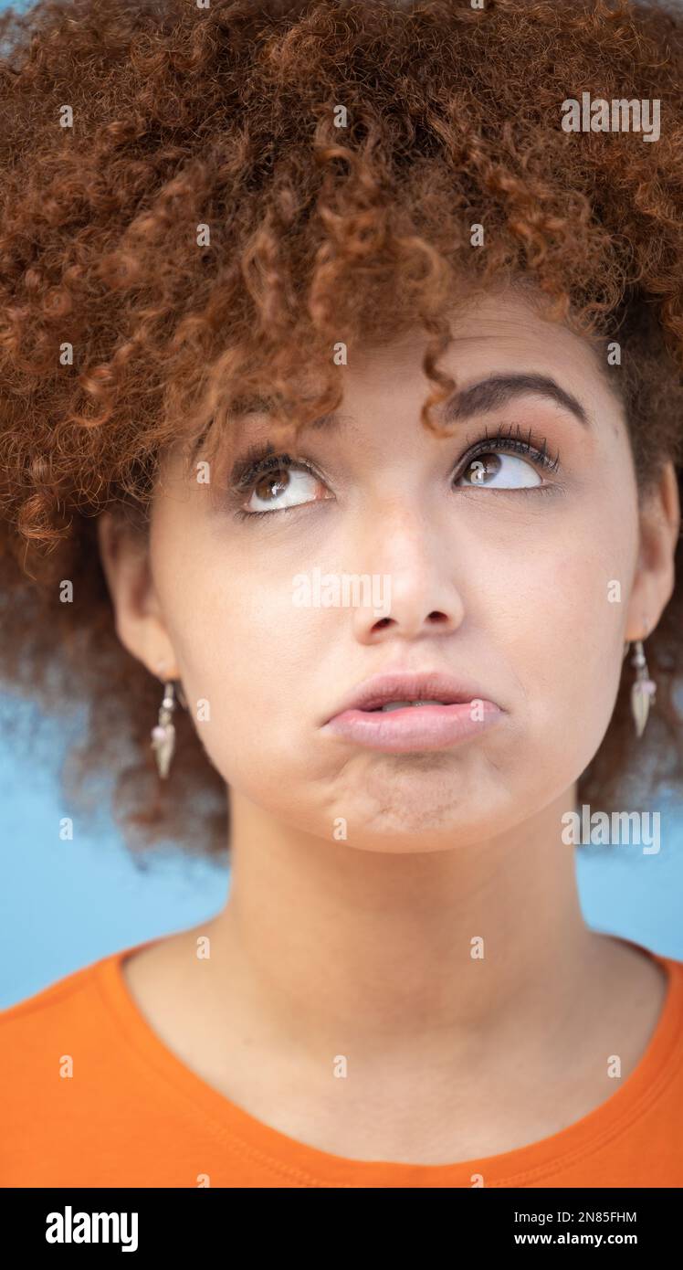 Comic, thinking and sad face of woman on blue background upset, unhappy ...