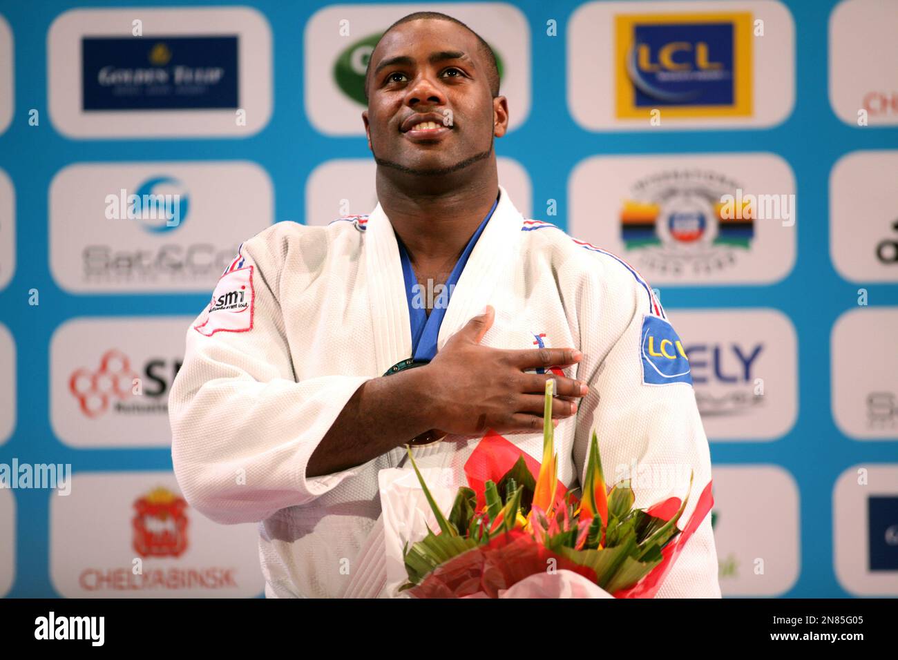 Teddy Riner of France poses with his medal, after winning his over 100 ...