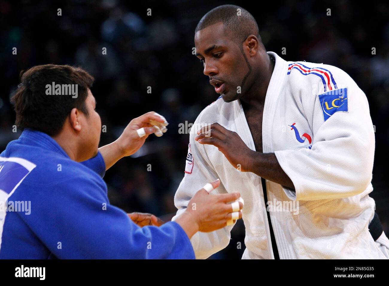 Teddy Riner of France, white jersey, fights Sung Min Kim of Korea ...