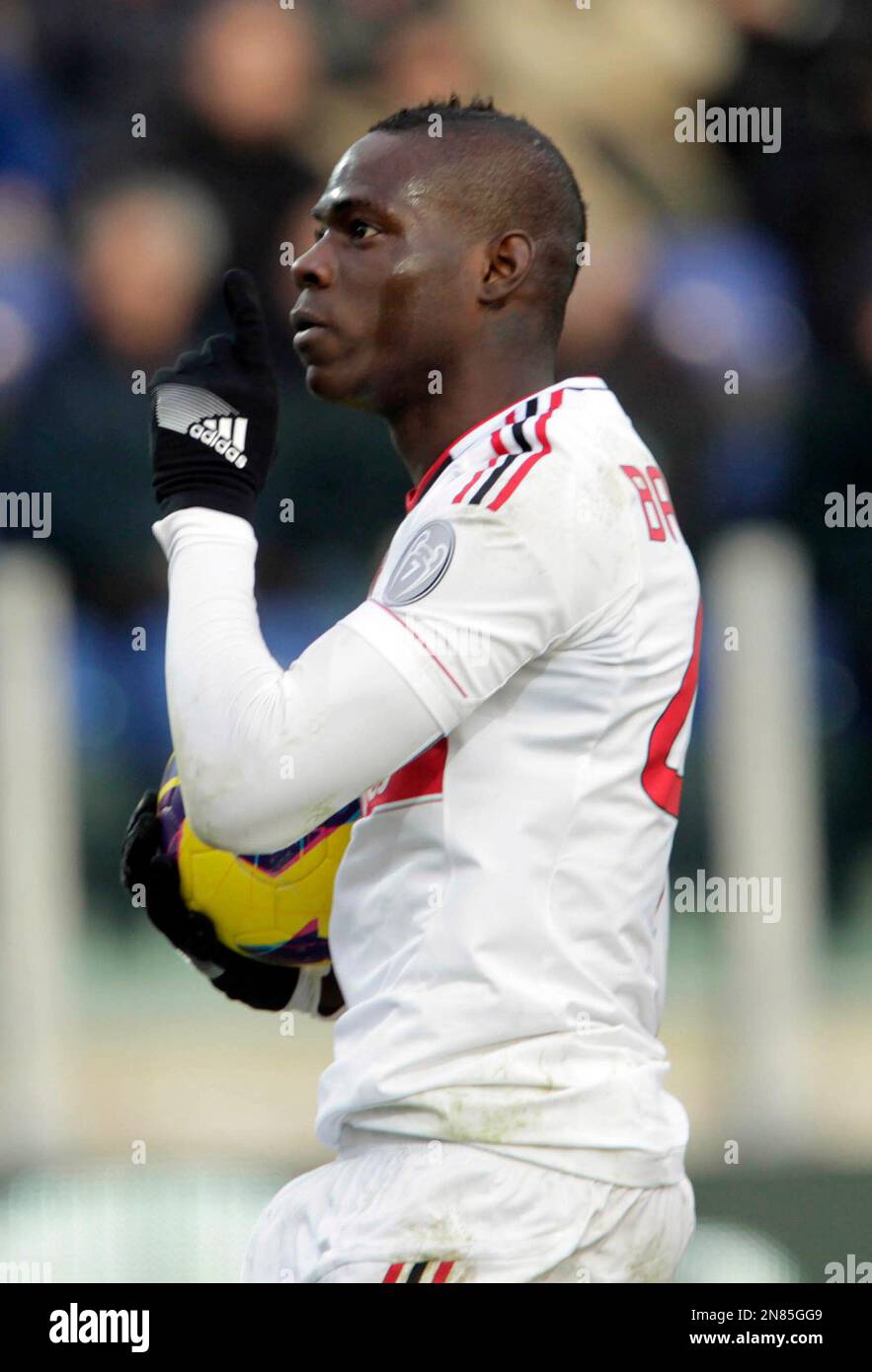AC Milan striker Mario Balotelli celebrates after scoring during a ...