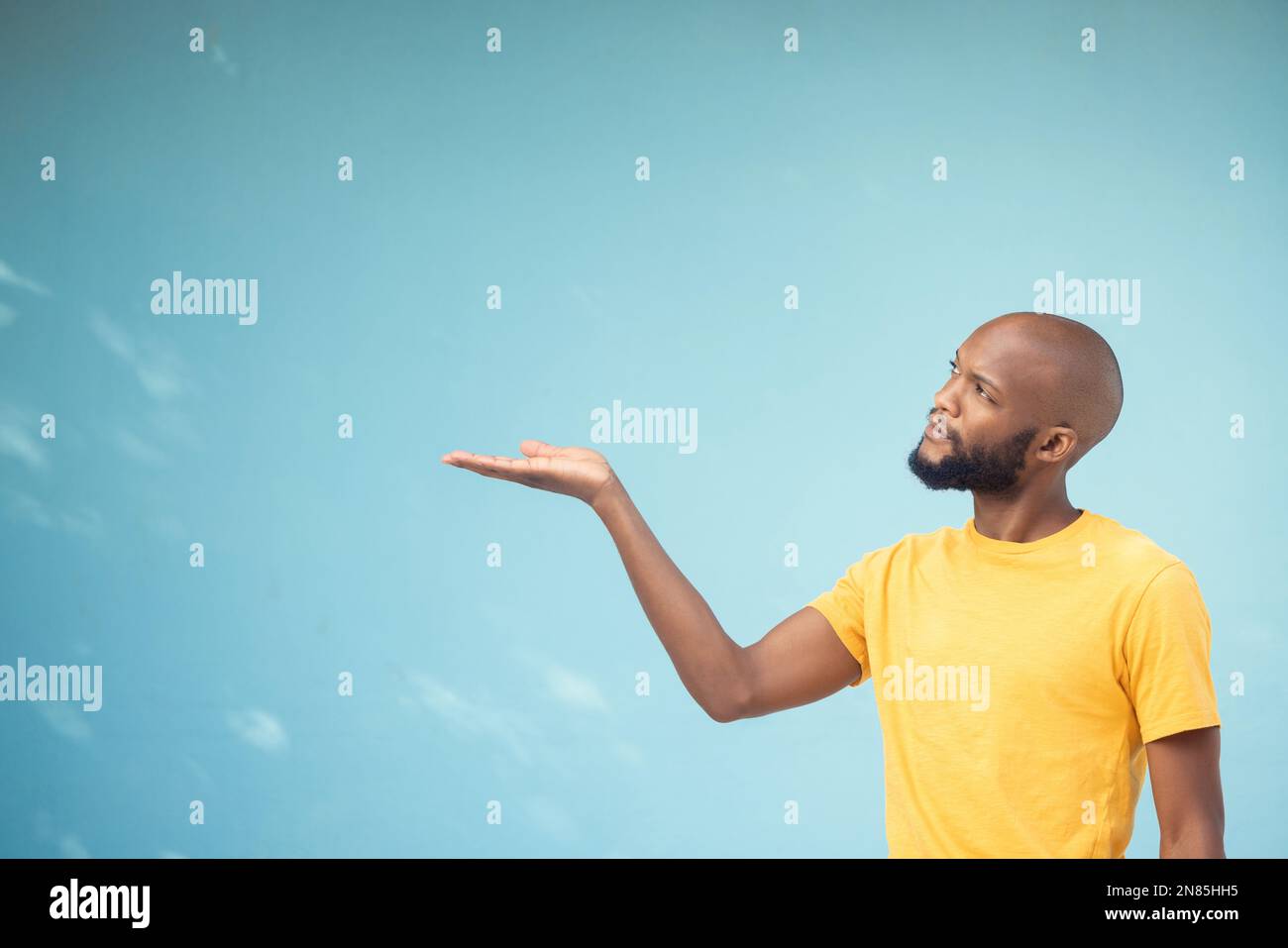 Advertising, product placement and hand of black man on blue background ...