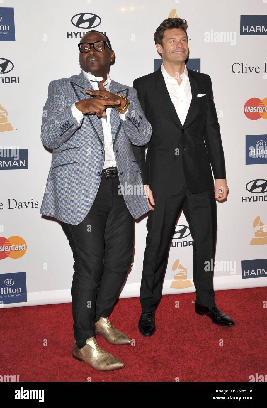 Music producer Randy Jackson, left, and TV personality Ryan Seacrest ...