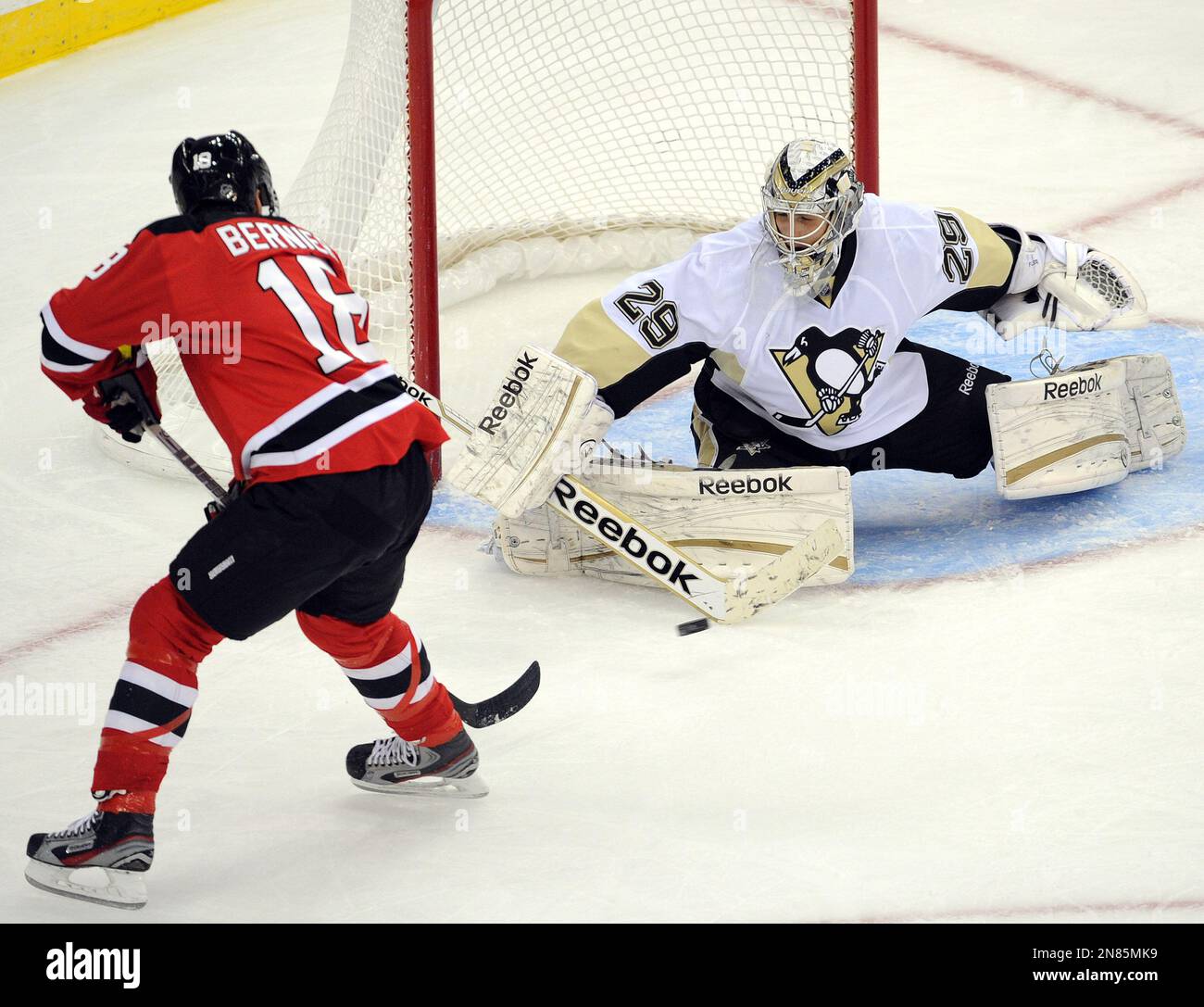 Pittsburgh Penguins goaltender Marc-Andre Fleury, right, makes a save ...