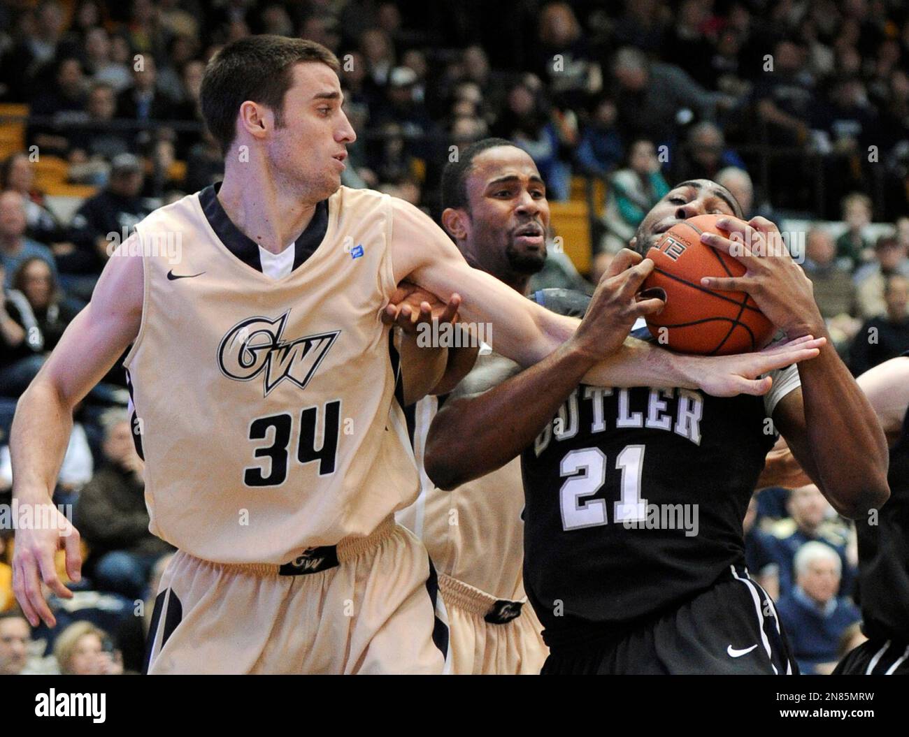 George Washington forward John Kopriva (34) reaches for the ball ...