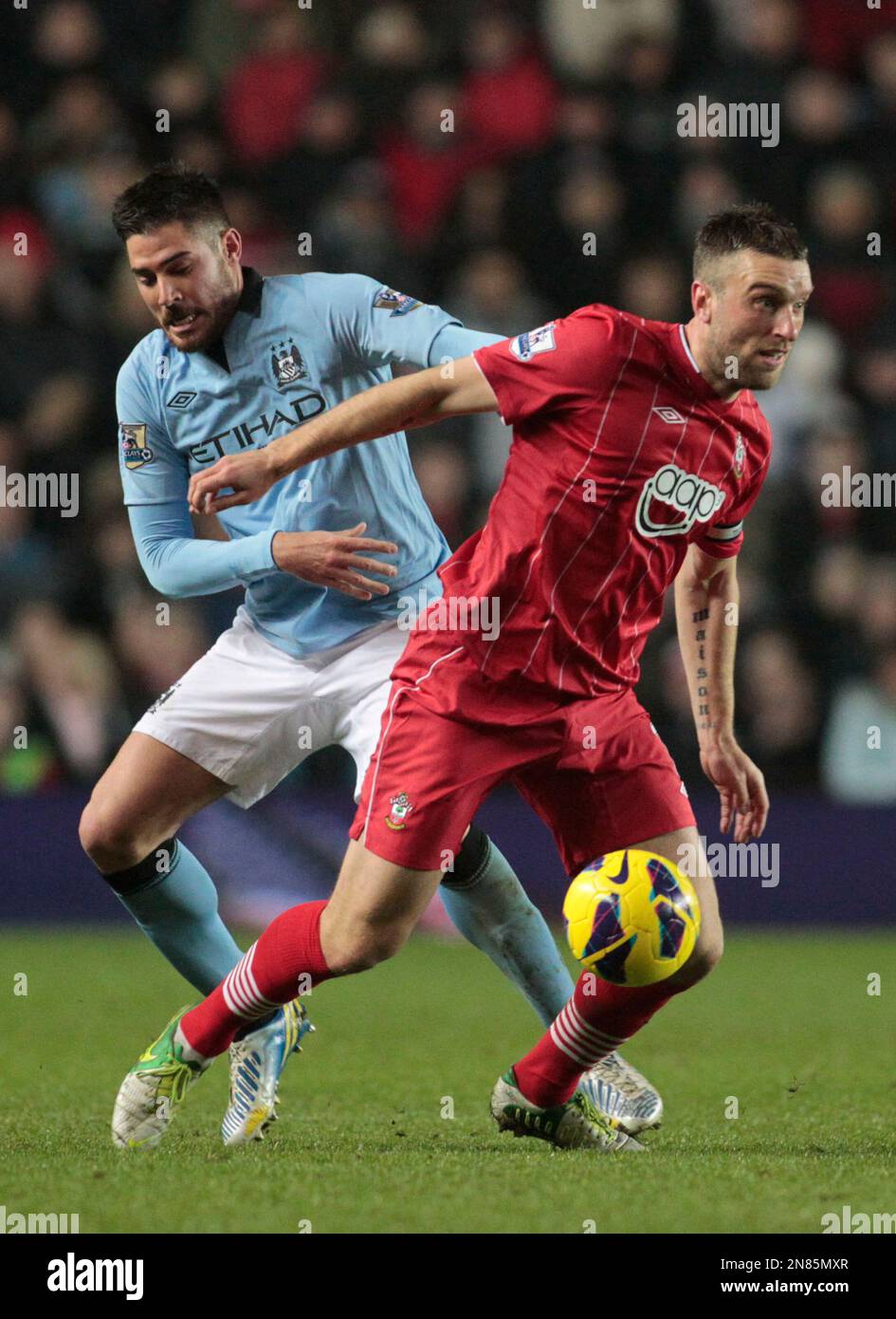 Southampton's Rickie Lambert, right, competes with Manchester City's ...
