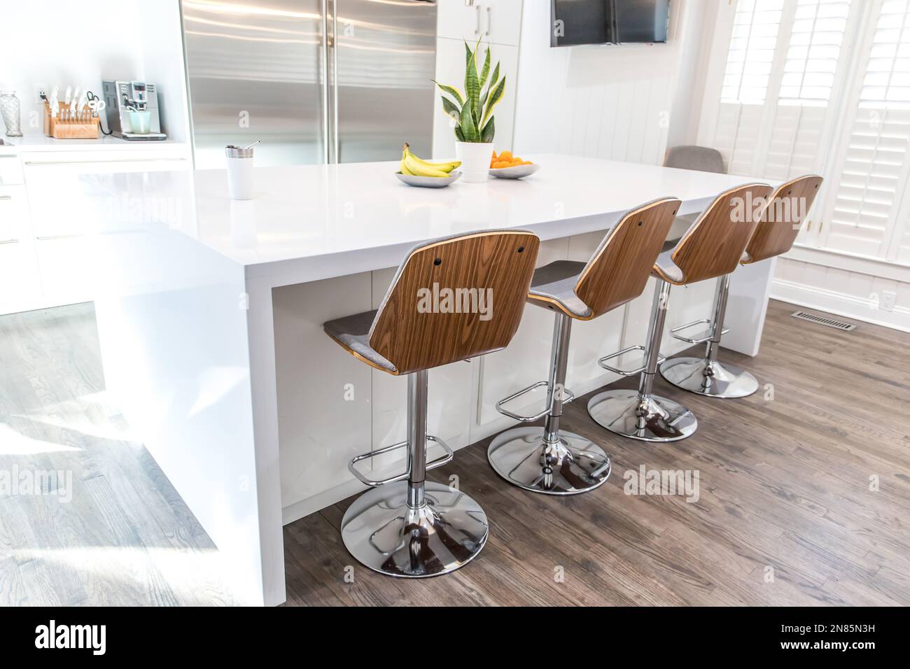 A large luxury modern kitchen quartz quartzite island with white walls ...