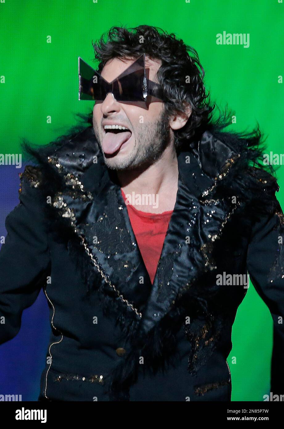 French singer Mathieu Chedid, known as M, left, performs on stage ...