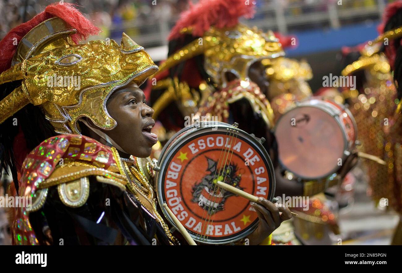 Drummers from the Dragoes da Real samba school perform during a ...