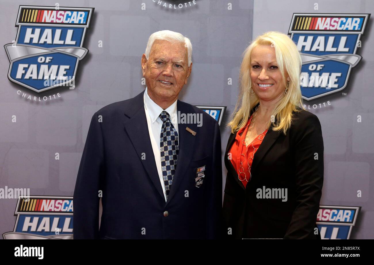 Hall of Fame driver Junior Johnson and his wife, Lisa pose on the red ...