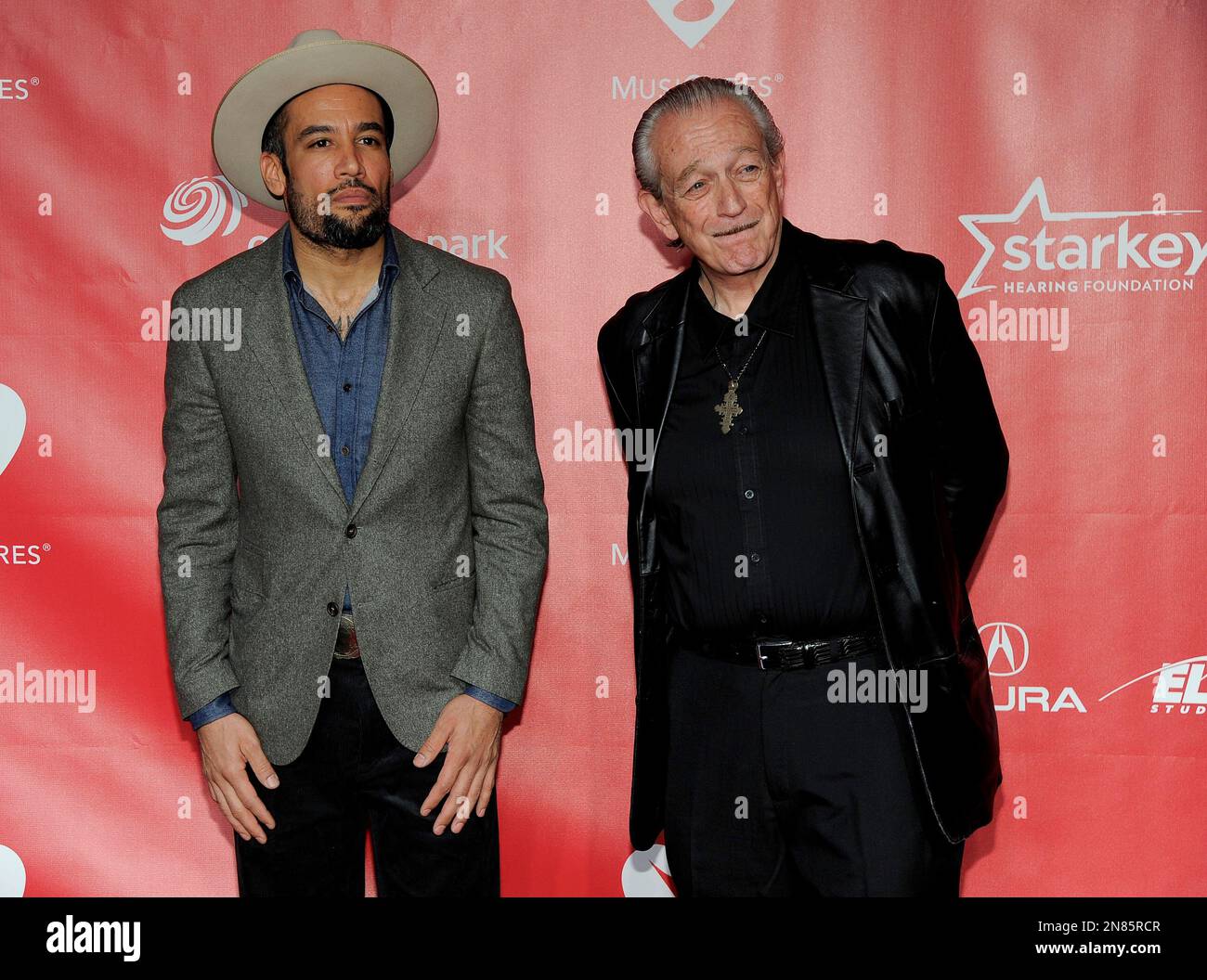 Ben Harper, left, and Charlie Musselwhite arrive at the MusiCares ...