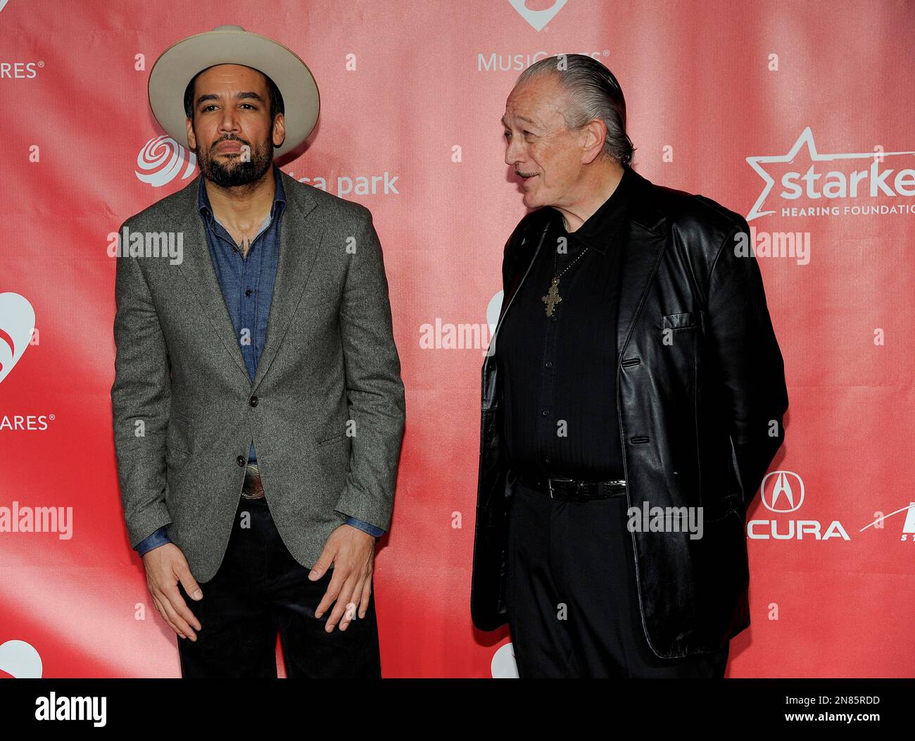 Ben Harper, left, and Charlie Musselwhite arrive at the MusiCares ...