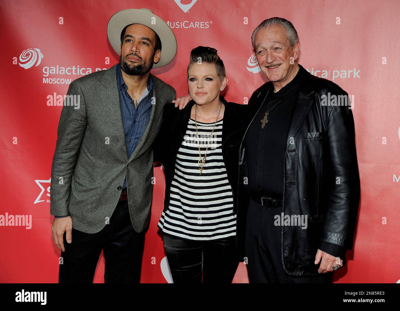 From left, Ben Harper, Natalie Maines and Charlie Musselwhite arrive at ...