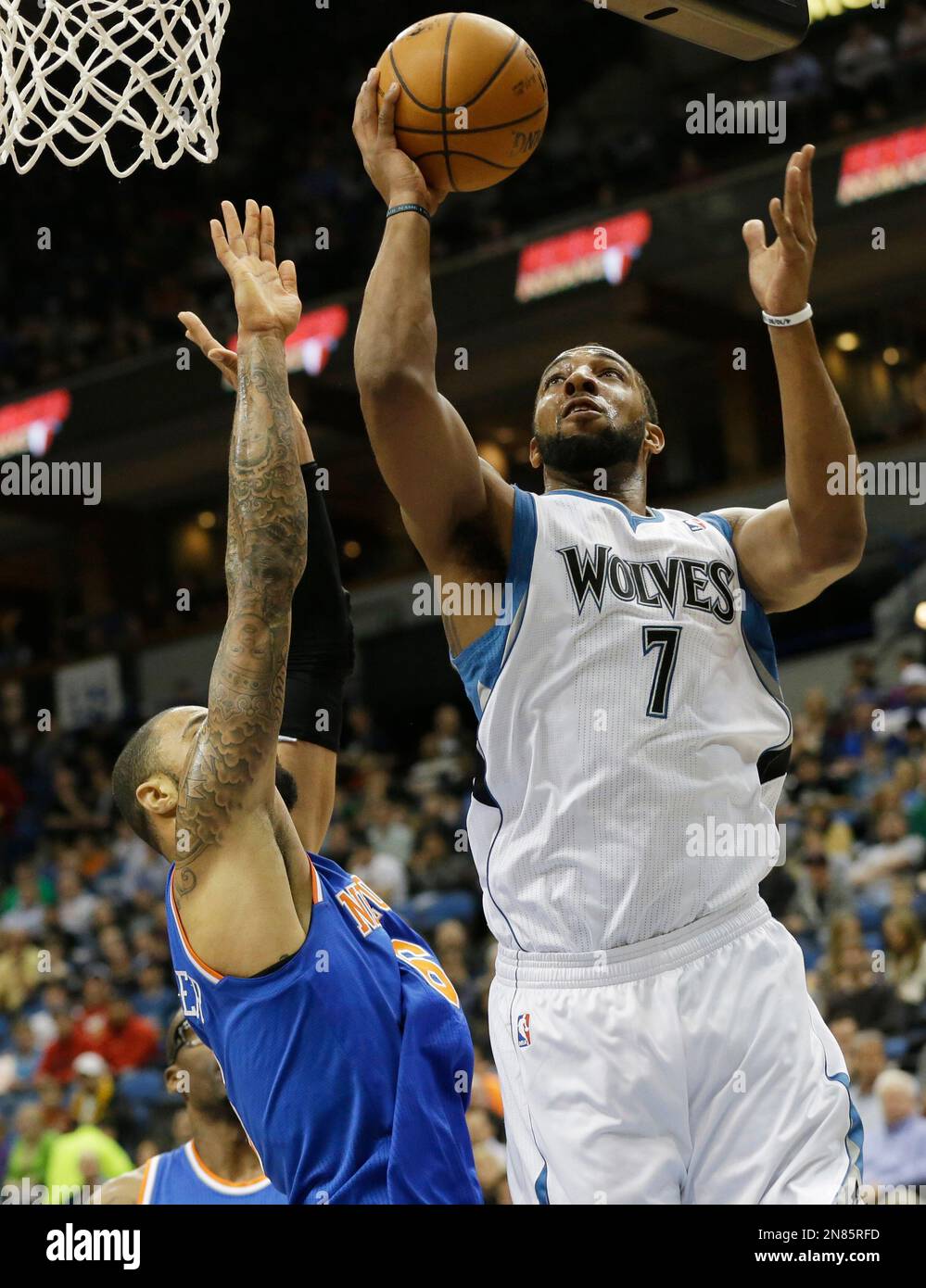 Minnesota Timberwolves' Derrick Williams, right, lays up as New York ...