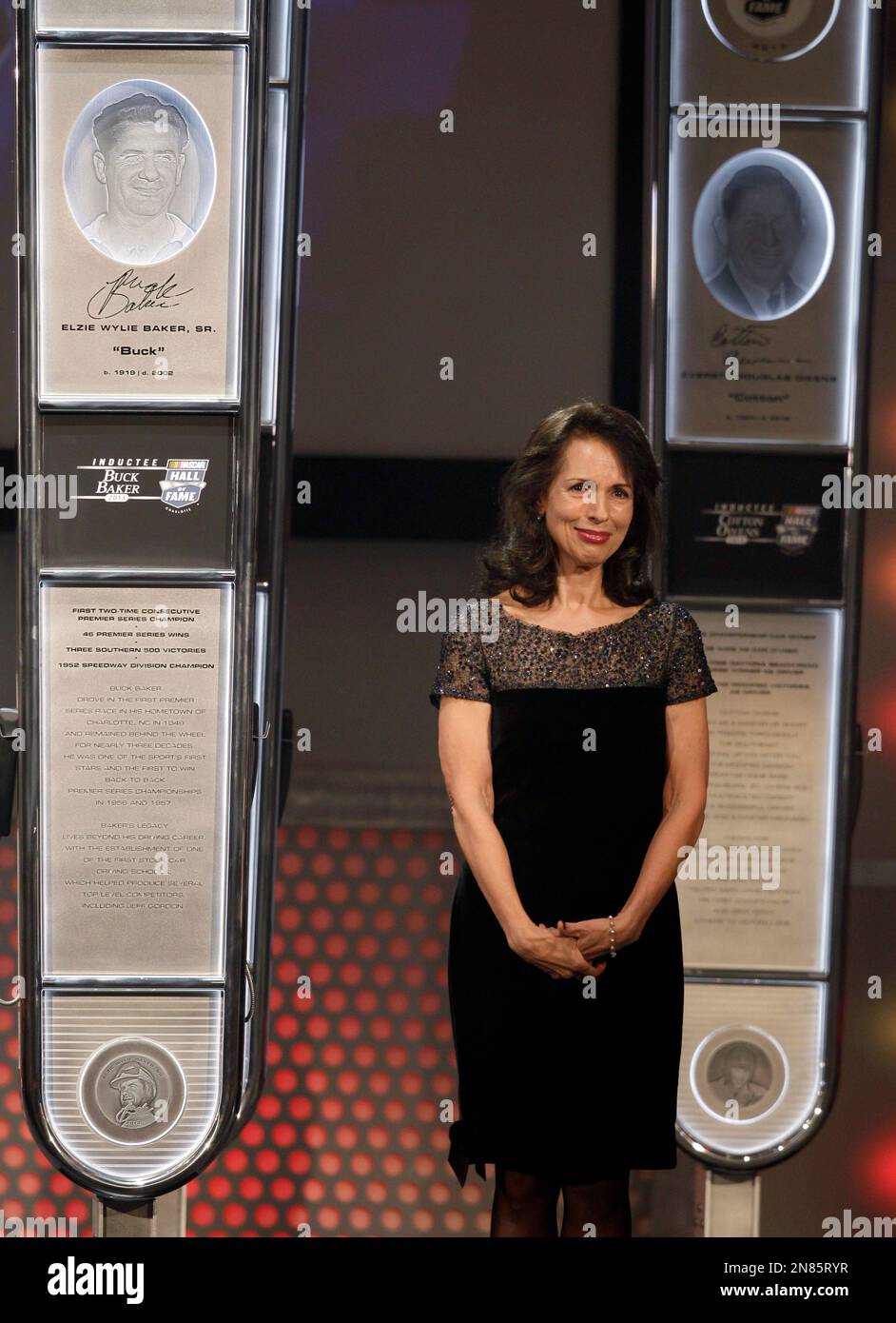 Susan Baker stands next to the spire in honor of her late husband, Buck ...