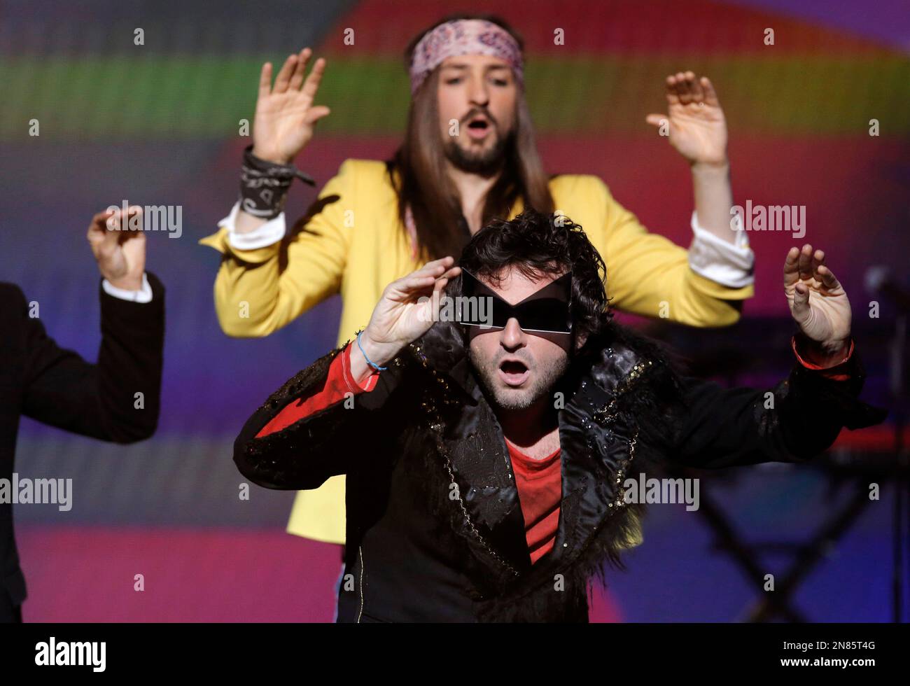 French singer Mathieu Chedid, known as M, left, performs on stage ...