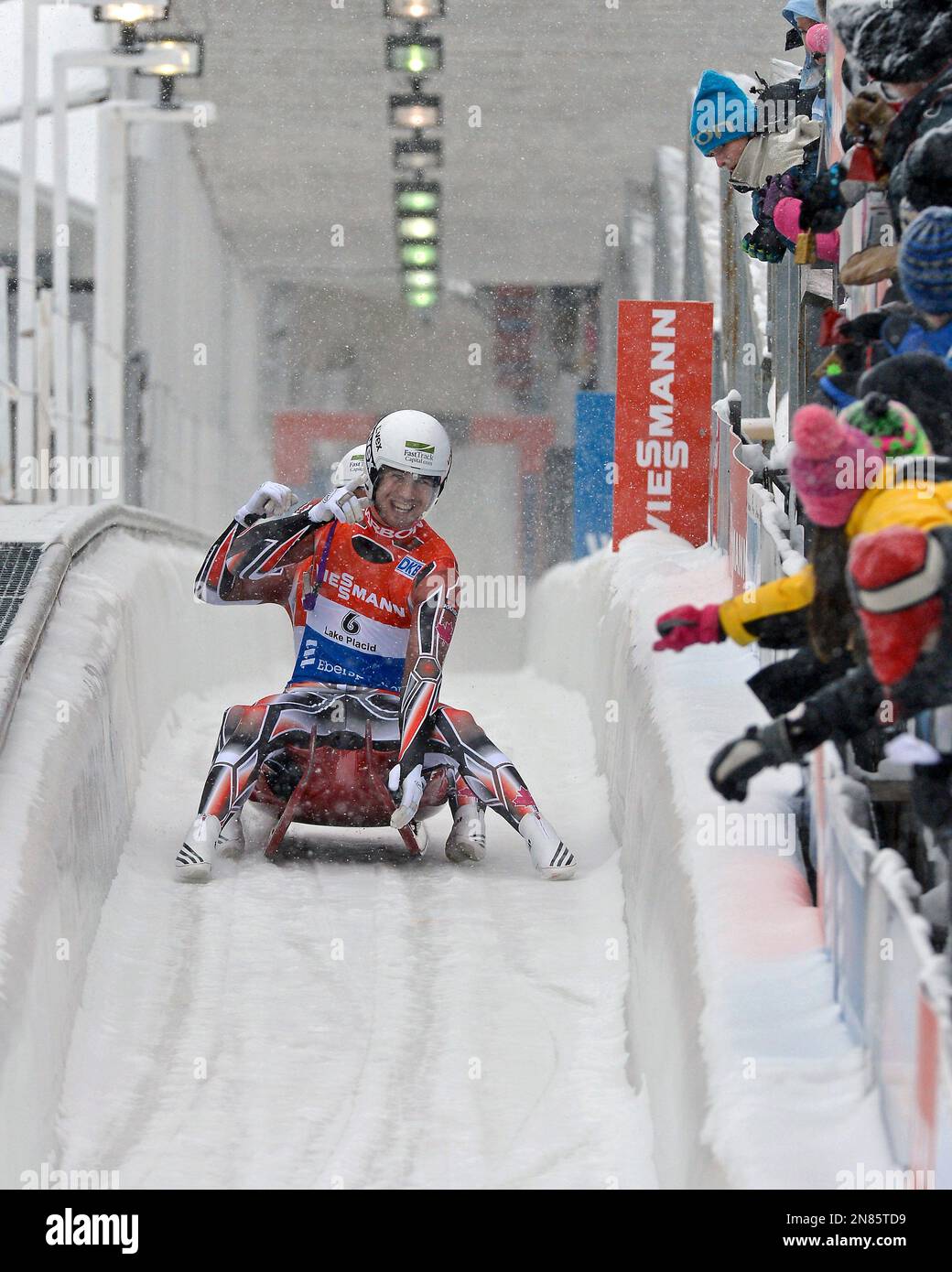 Tristan Walker and Justin Snith, of Canada, compete in the men's Luge ...
