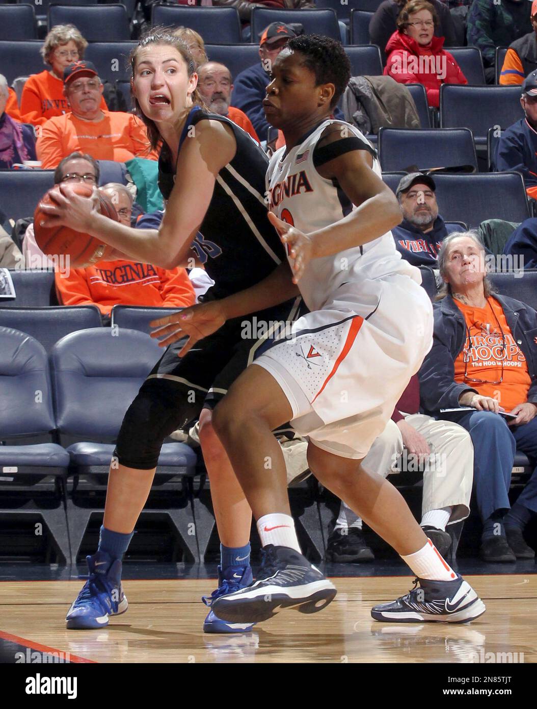 Duke's Haley Peters, left, works against Virginia forward Sarah ...