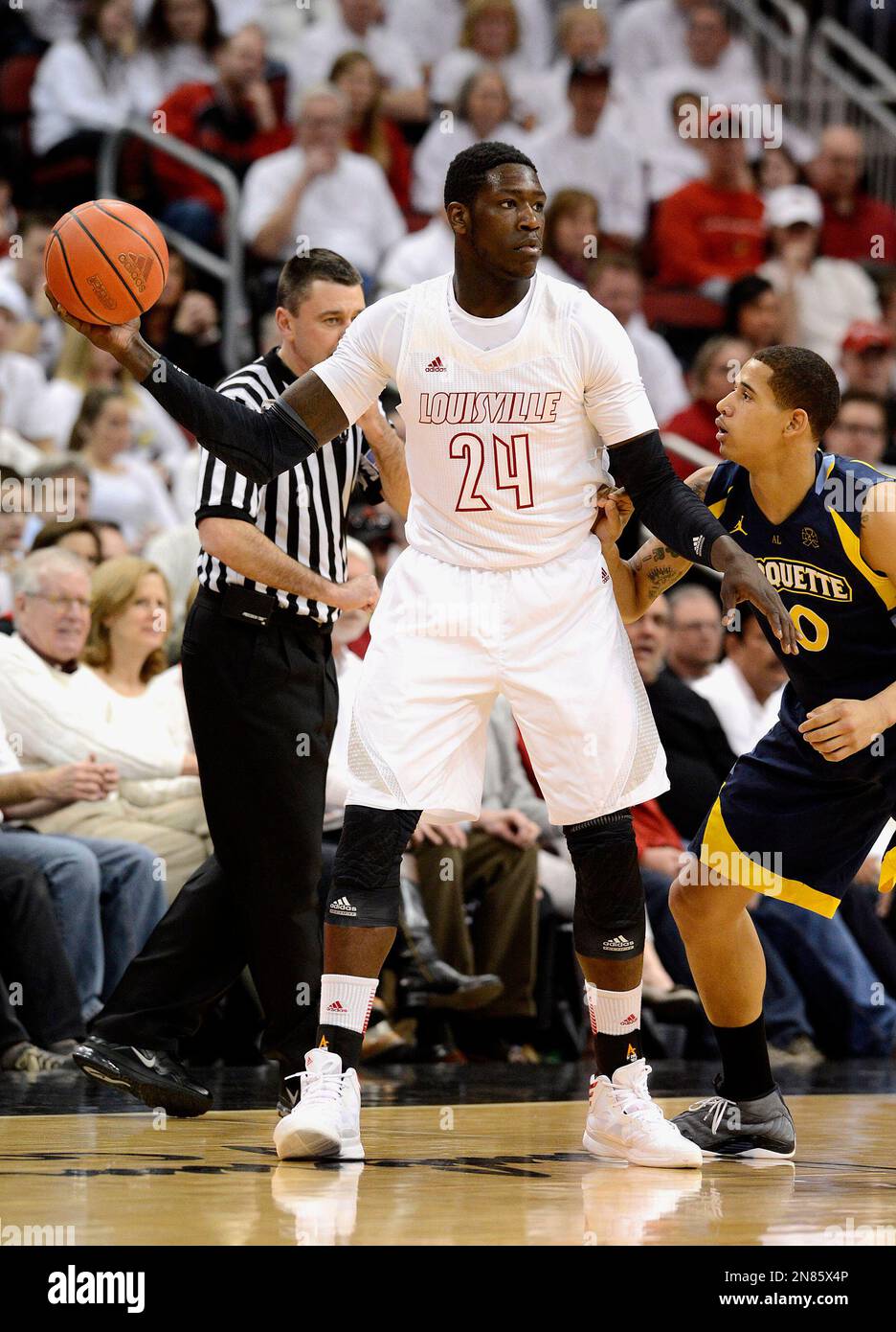 Louisville's Montrezl Harrell, left, looks for help from the defense of ...