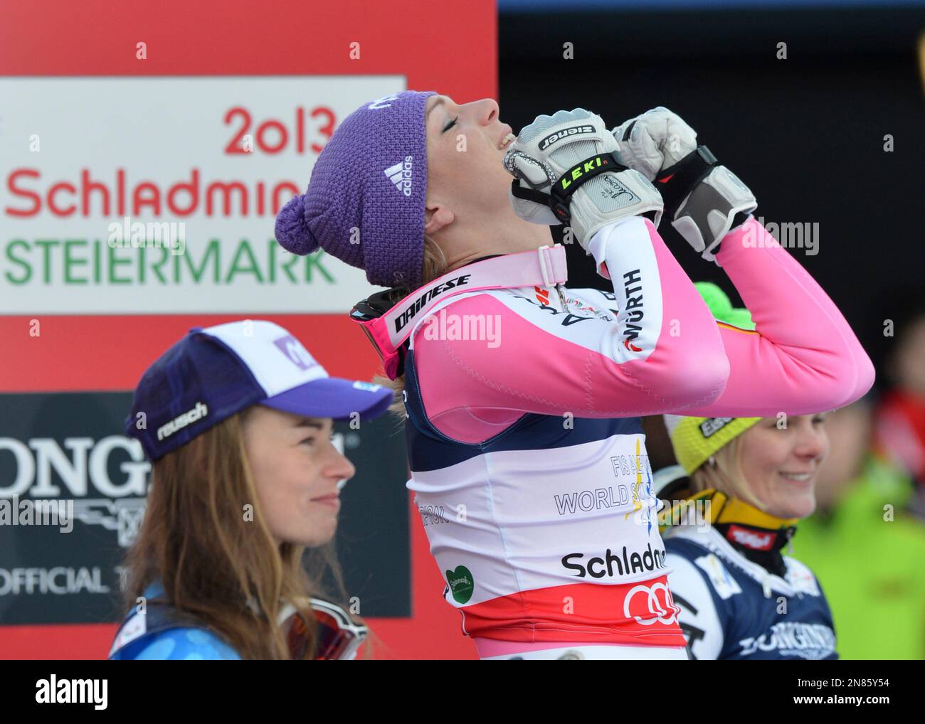 Germany's gold medal winnerMaria Hoefl-Riesch is flanked by Slovenia's ...