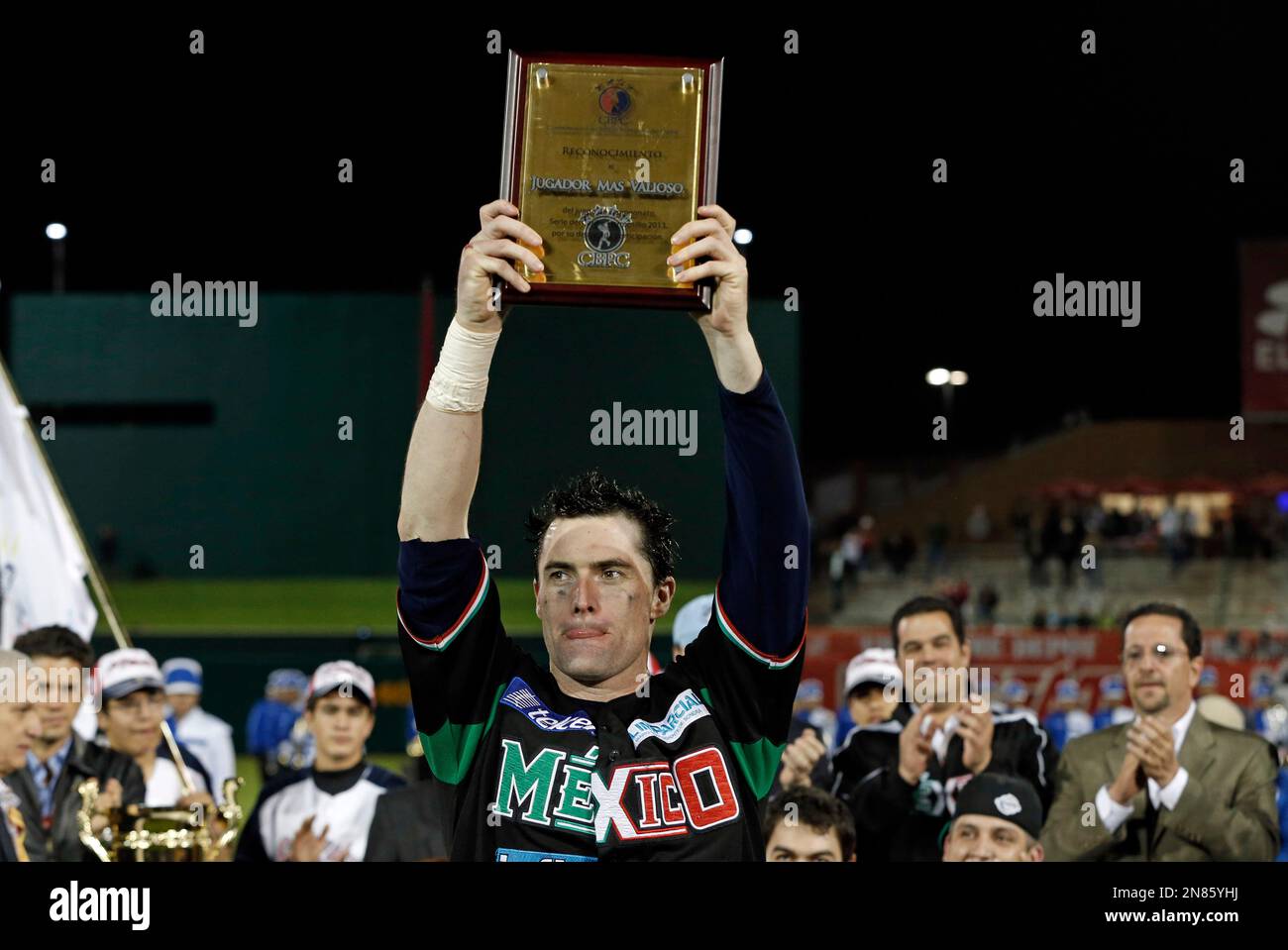 Mexico's Douglas Clark raises his plaque for the Most Valuable Player ...