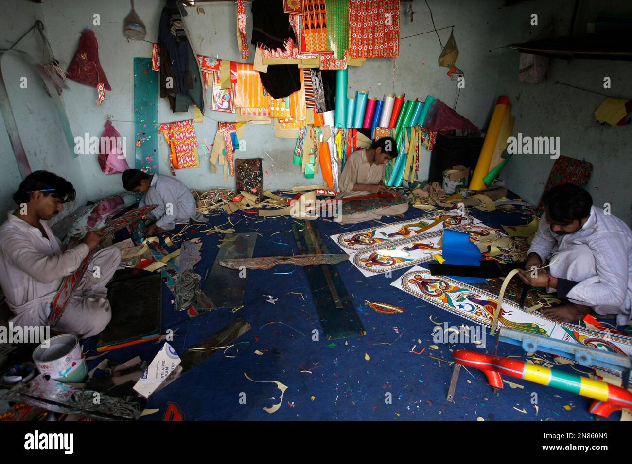 In this Saturday, Feb. 2, 2013 photo, Pakistani artists prepare ...