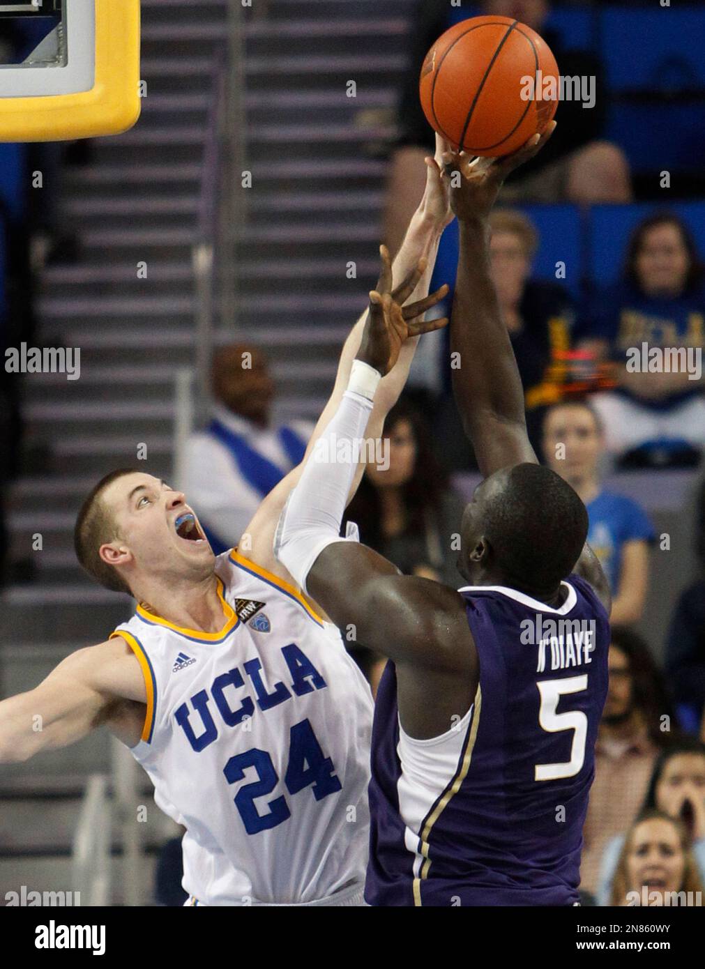 UCLA forward Travis Wear (24) blocks the shot of Washington center Aziz ...