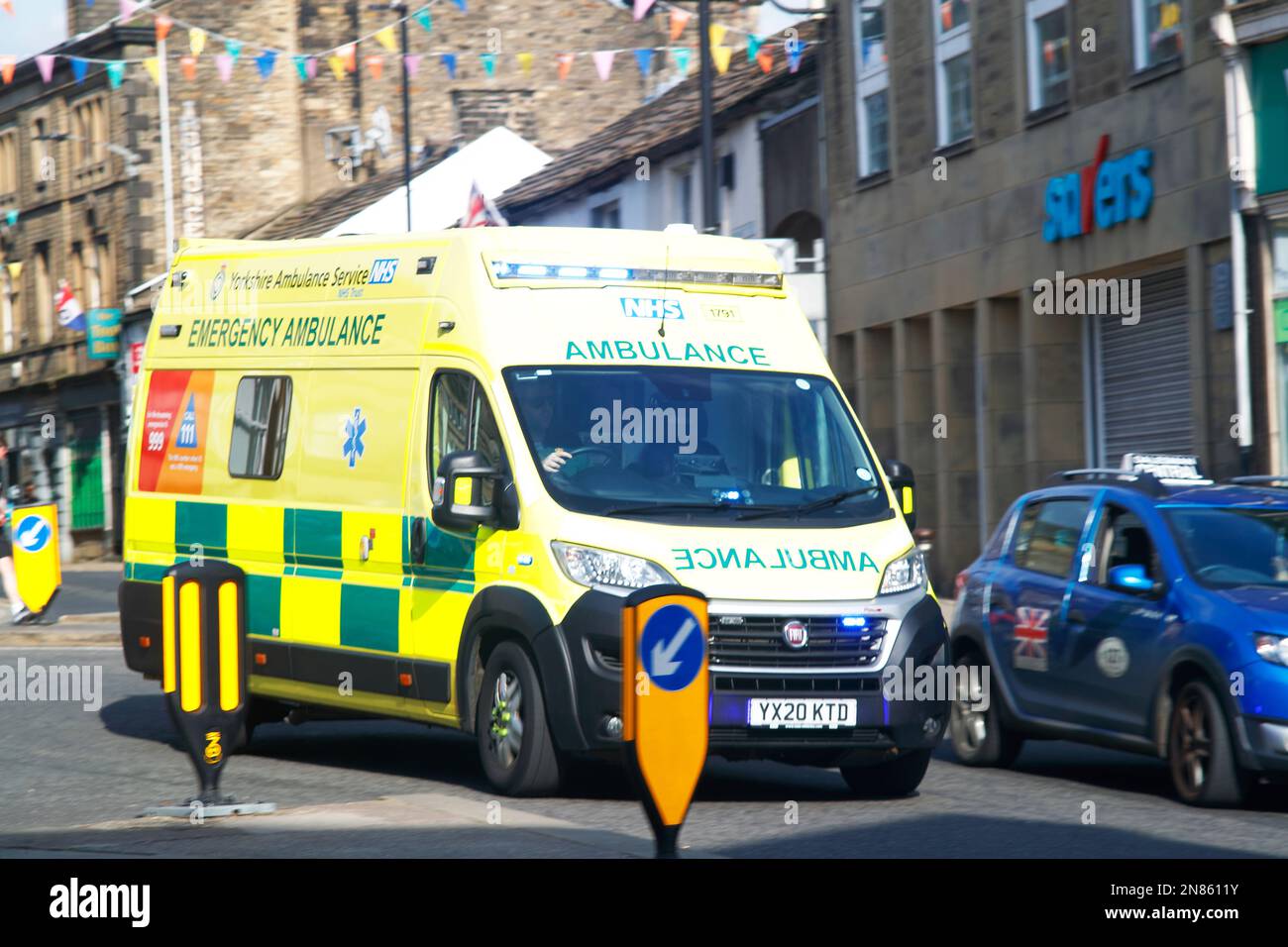 NHS Emergency Ambulance heading towards Bradford road from High Streeet ...