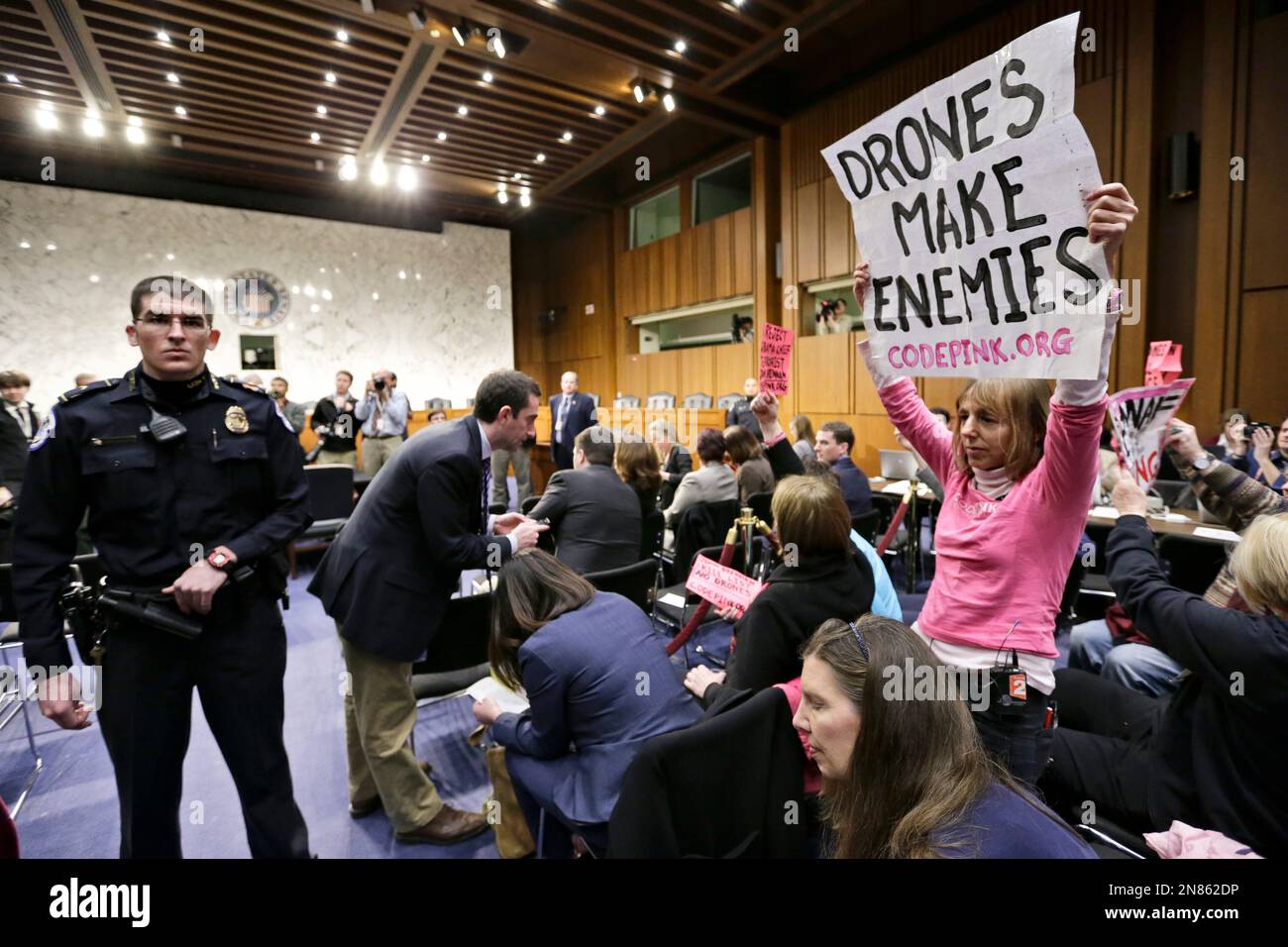 CODEPINK co-founder Medea Benjamin, right and other CODEPINK protestors ...