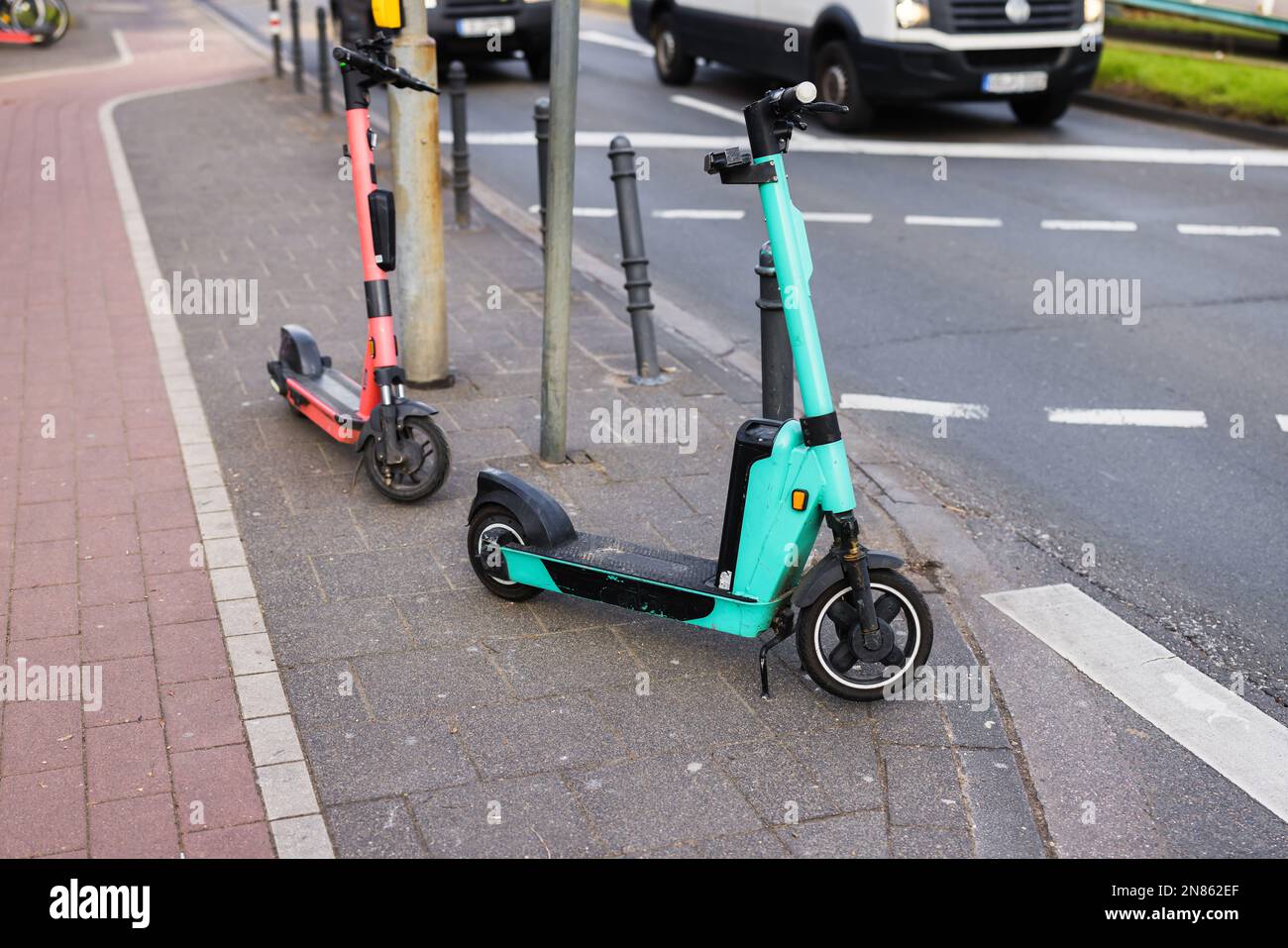 two e-scooter parking at the side of a city road Stock Photo - Alamy