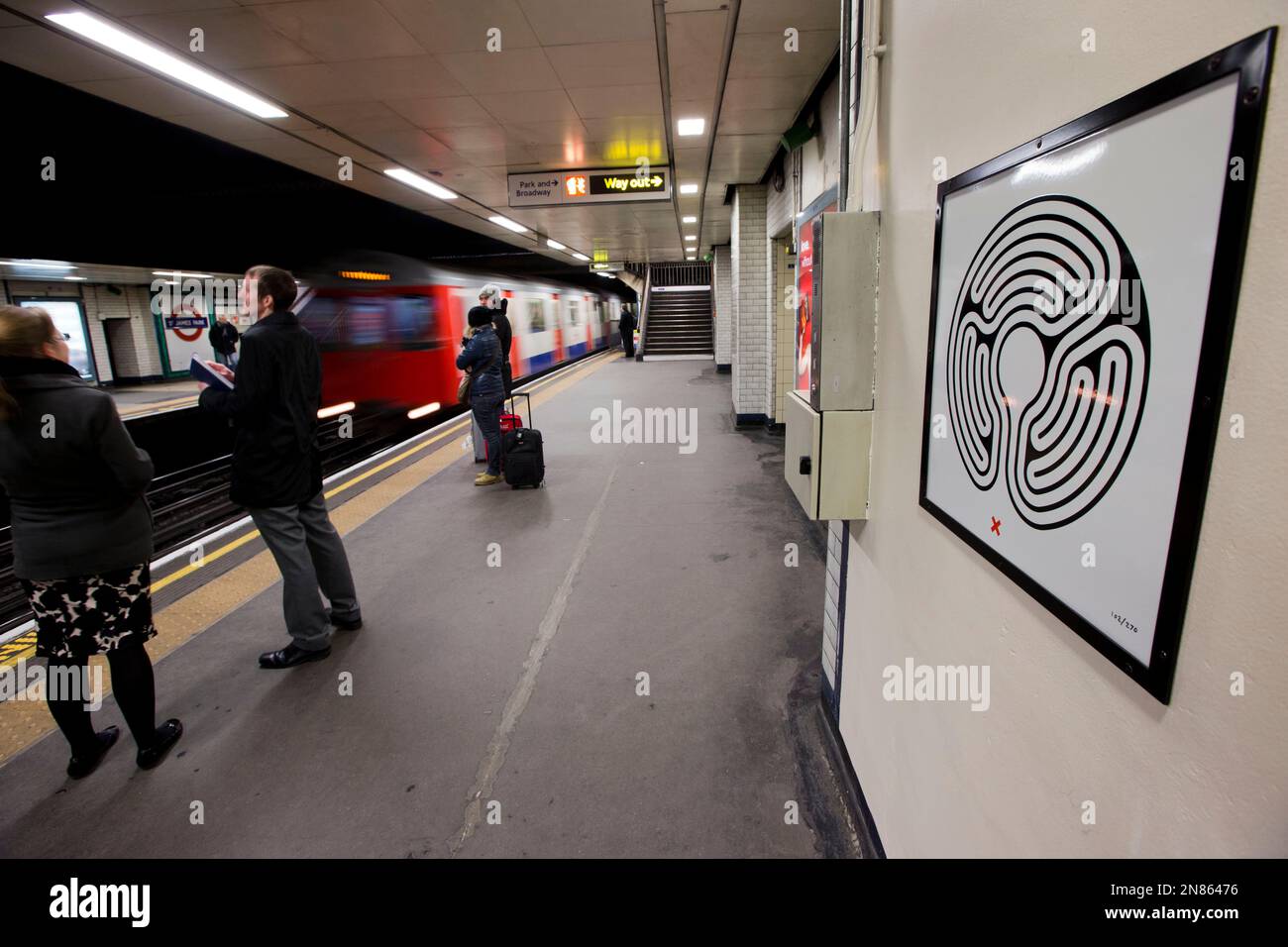 A tube train comes into the platform after British Turner Prize winning ...