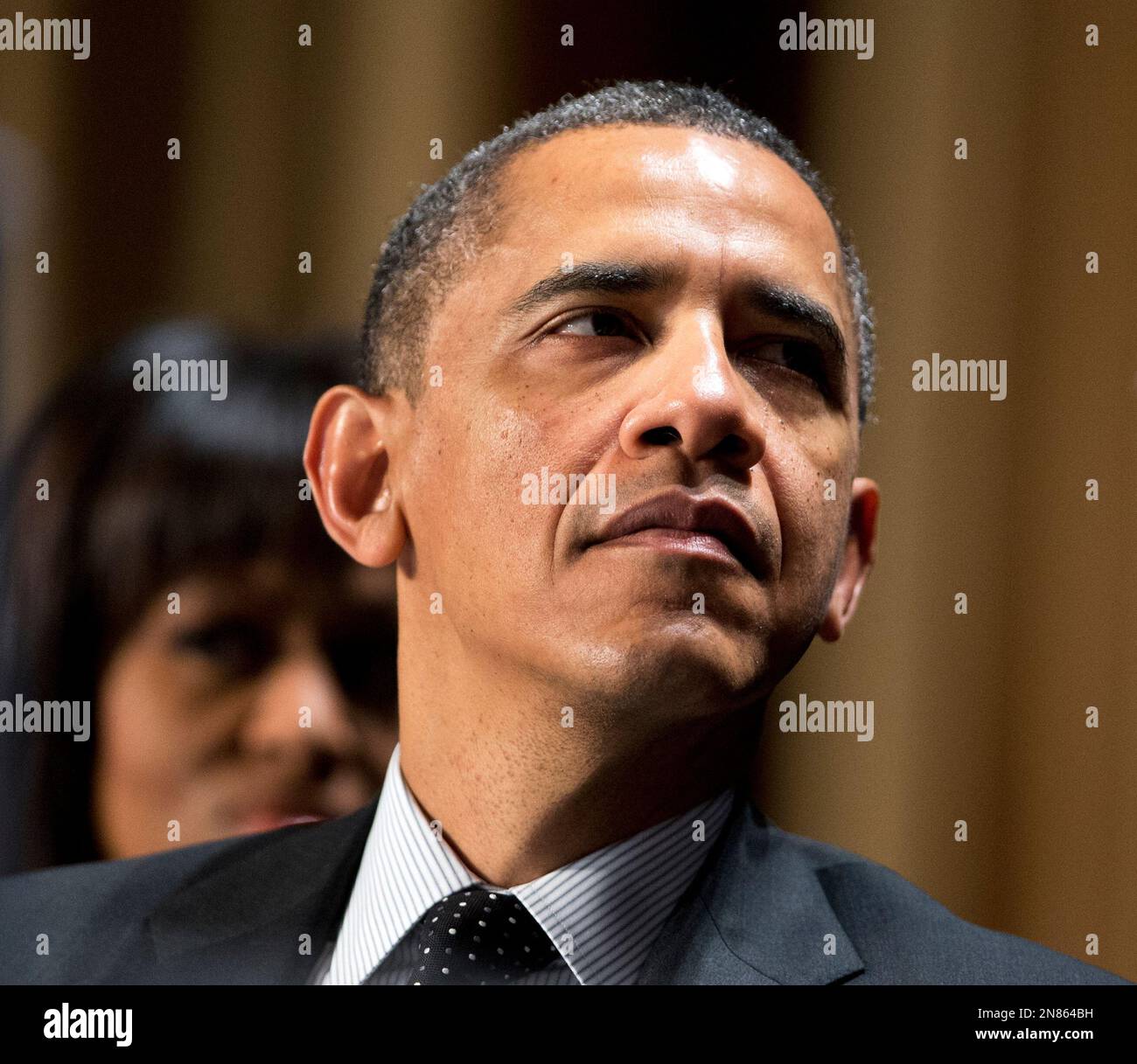 President Barack Obama with first lady Michelle Obama, watches and ...