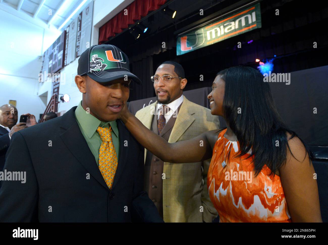 Ray Lewis III, left, is congratulated by his father, former Baltimore ...