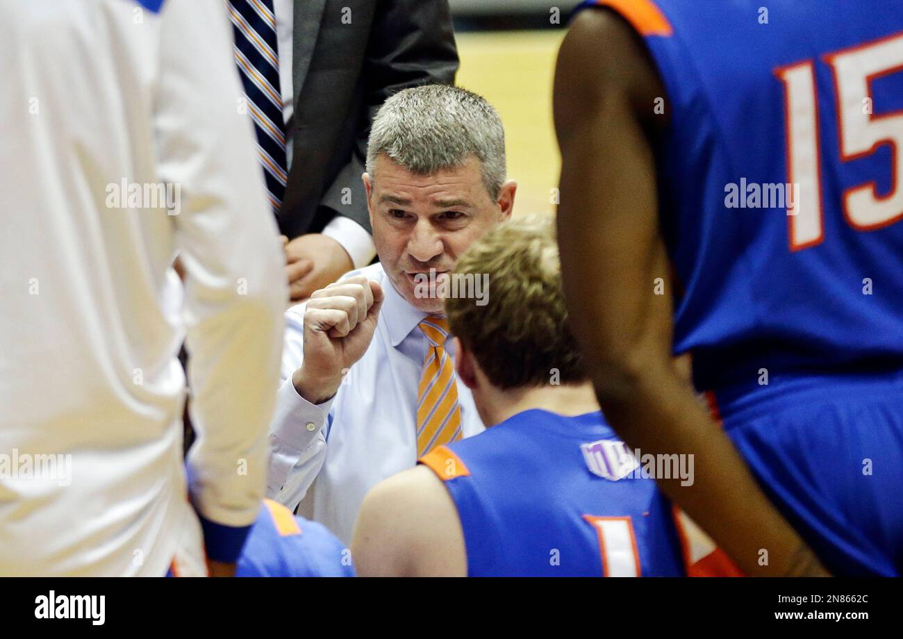 Boise State head coach Leon Rice urges his team on during a timeout in ...