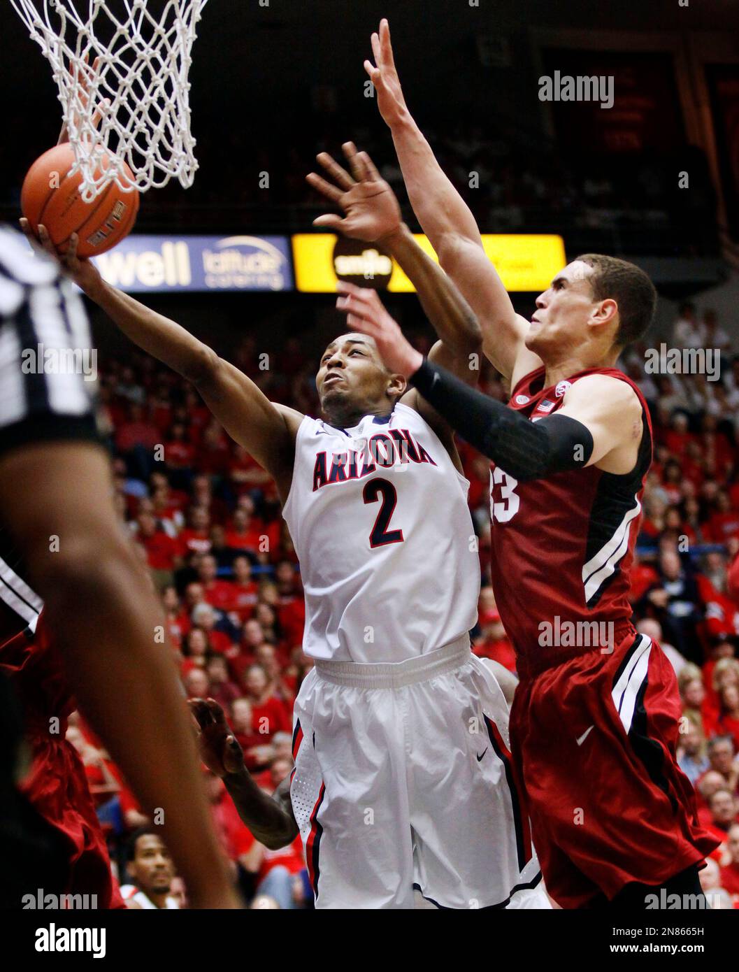 Arizona's Mark Lyons (2) shoots over Stanford's Dwight Powell (33 ...