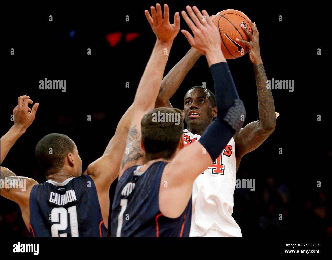 St. John's forward Jakarr Sampson (14) shoots over Connecticut guard ...