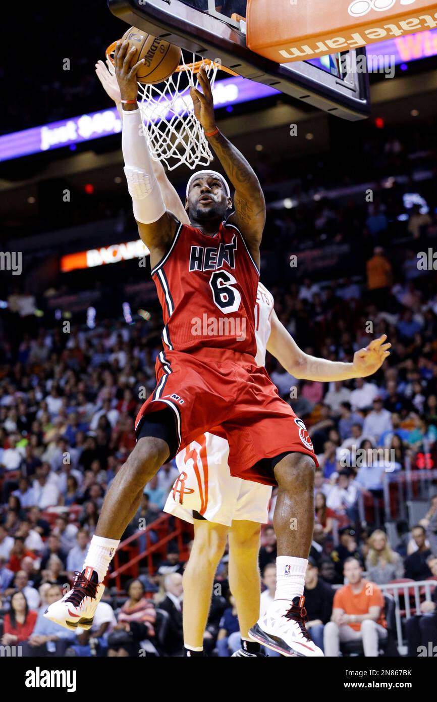 Miami Heat forward LeBron James (6) shoots past Houston Rockets center ...