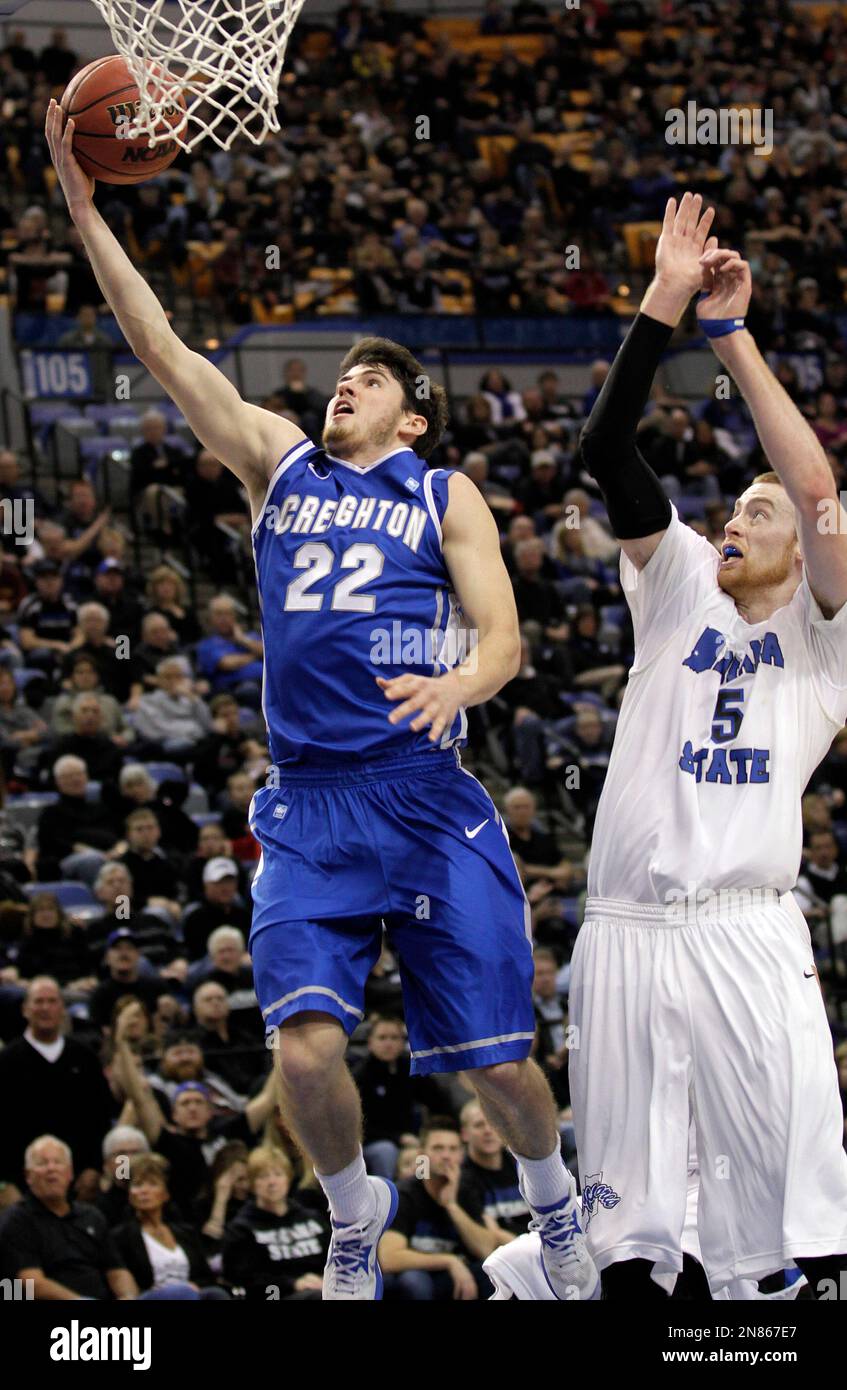 Creighton guard Avery Dingman, left, goes to the basket in front of ...