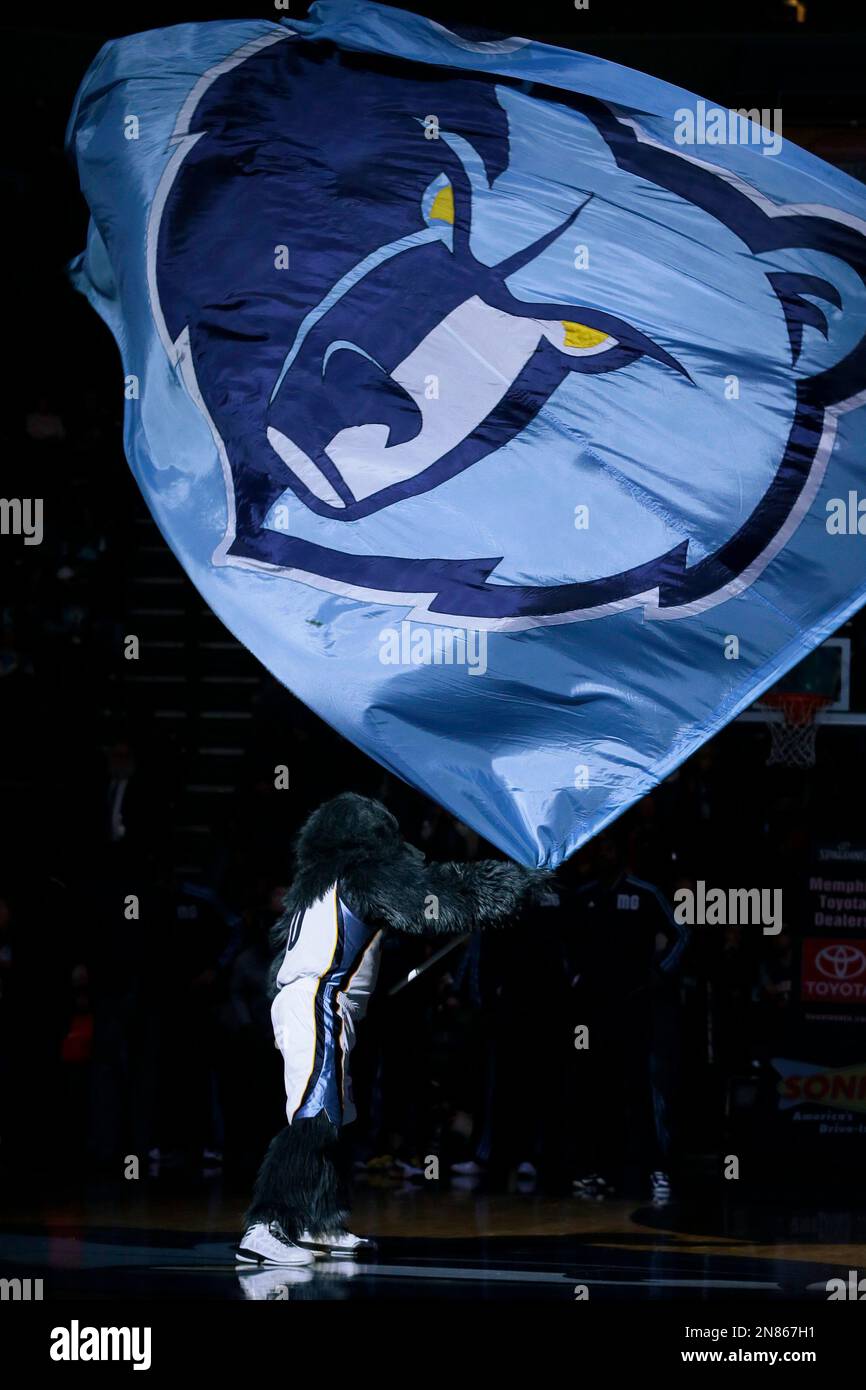 Griz, the Memphis Grizzlies mascot, waves a banner displaying the team ...