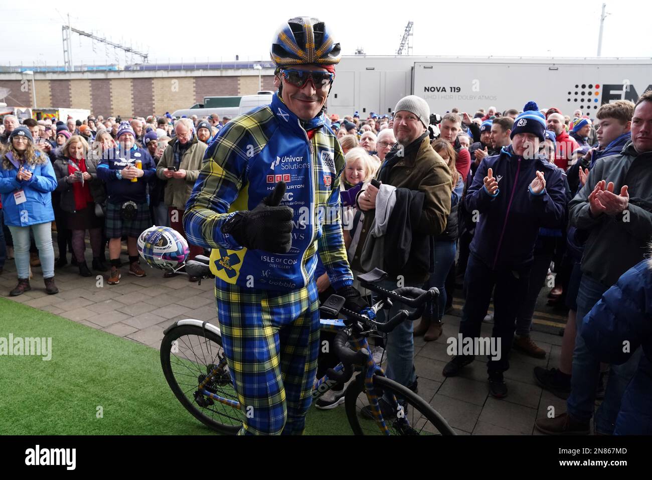 Former Scotland captain Rob Wainwright arrives with the match ball ...