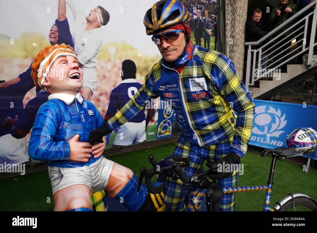 Former Scotland captain Rob Wainwright arrives with the match ball ...