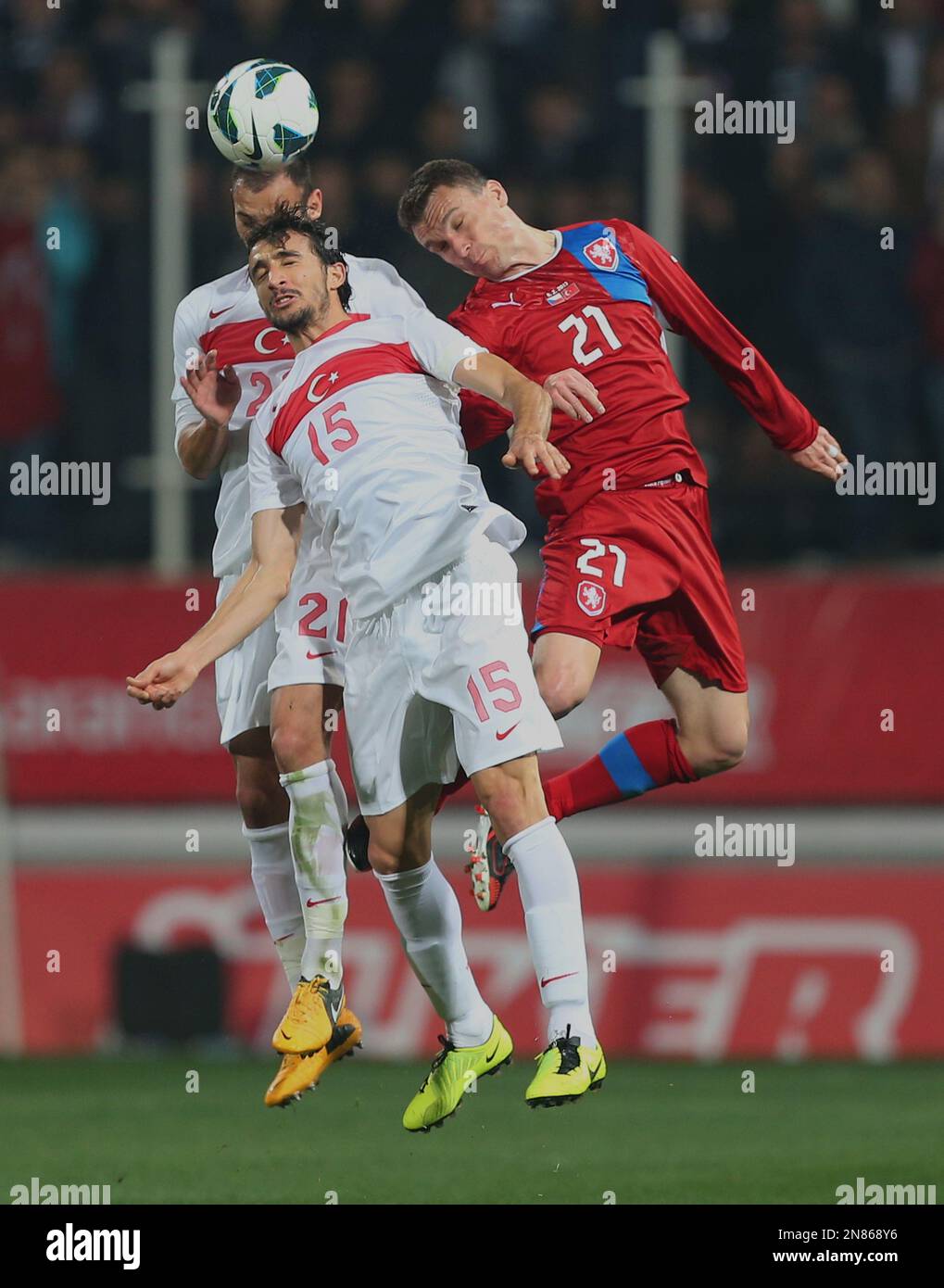 Turkey's Omer Toprak, rear, and Mehmet Topal, front, vies for the ball ...